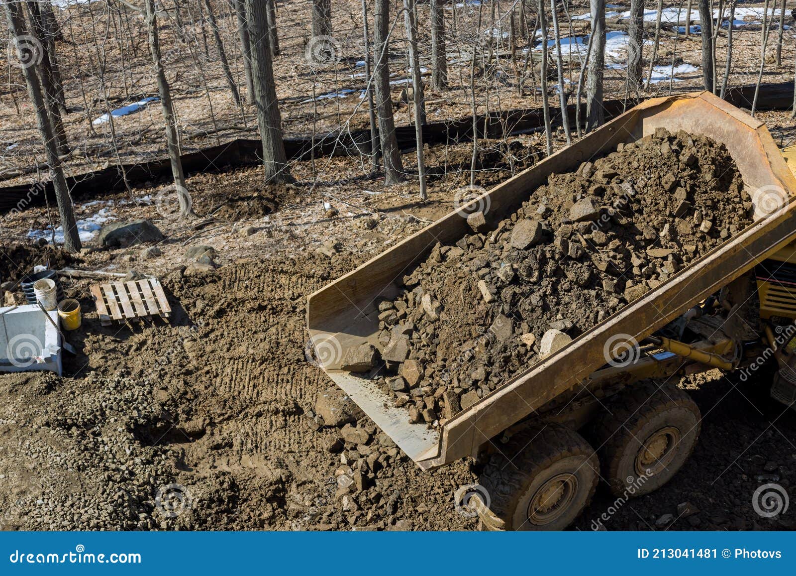Road Construction Highway Road on Dump Truck Dumps Its Load of Rock and ...