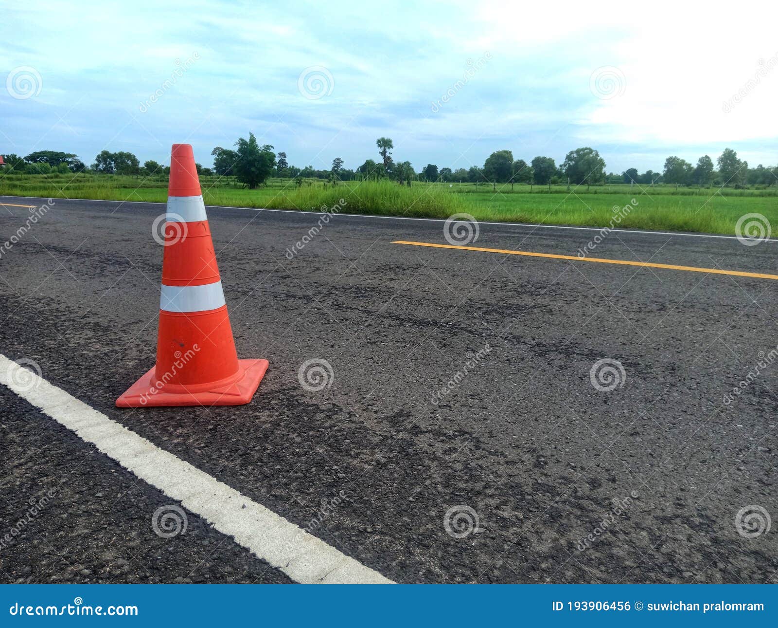 Road Construction with a Red Rubber Cone in Front Stock Photo - Image ...