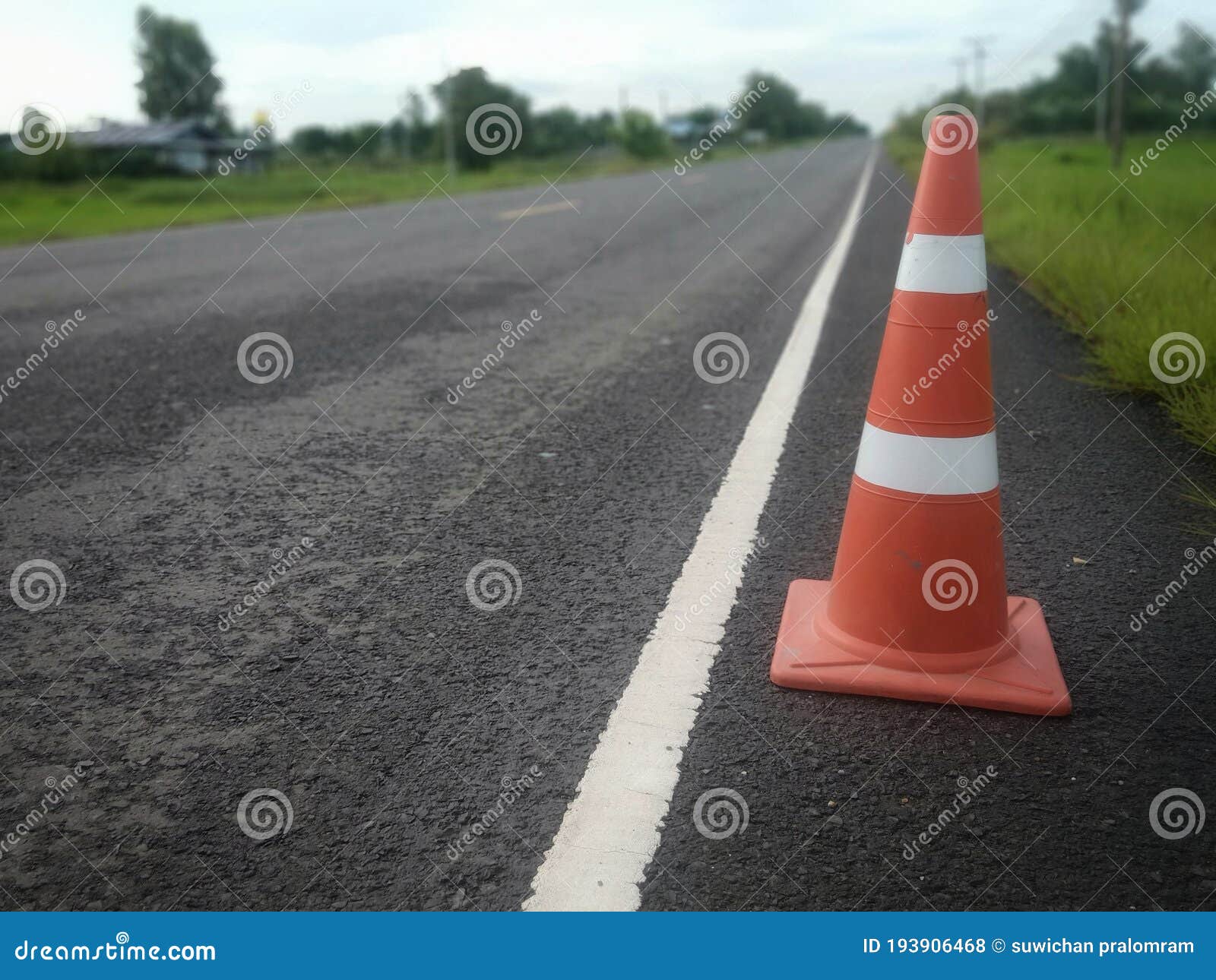 Road Construction with a Red Rubber Cone in Front Stock Photo - Image ...