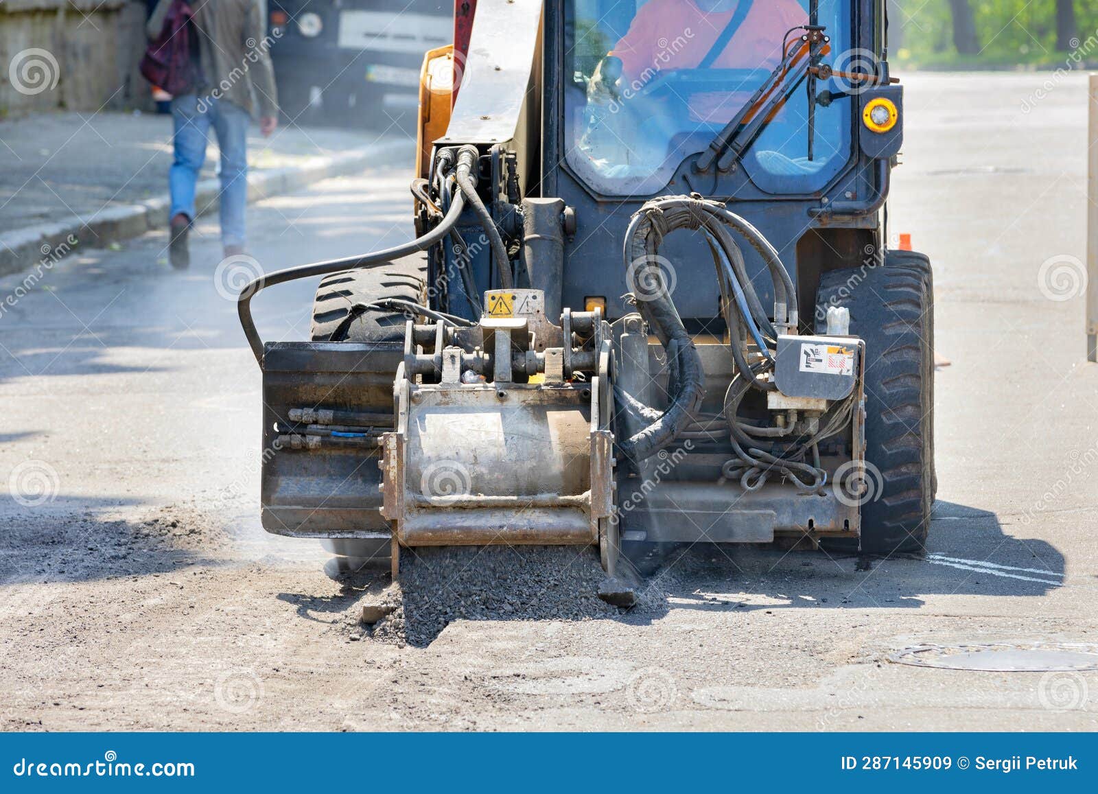 A Mounted Road Mill Removes a Layer of Old Asphalt on the Roadway Stock ...
