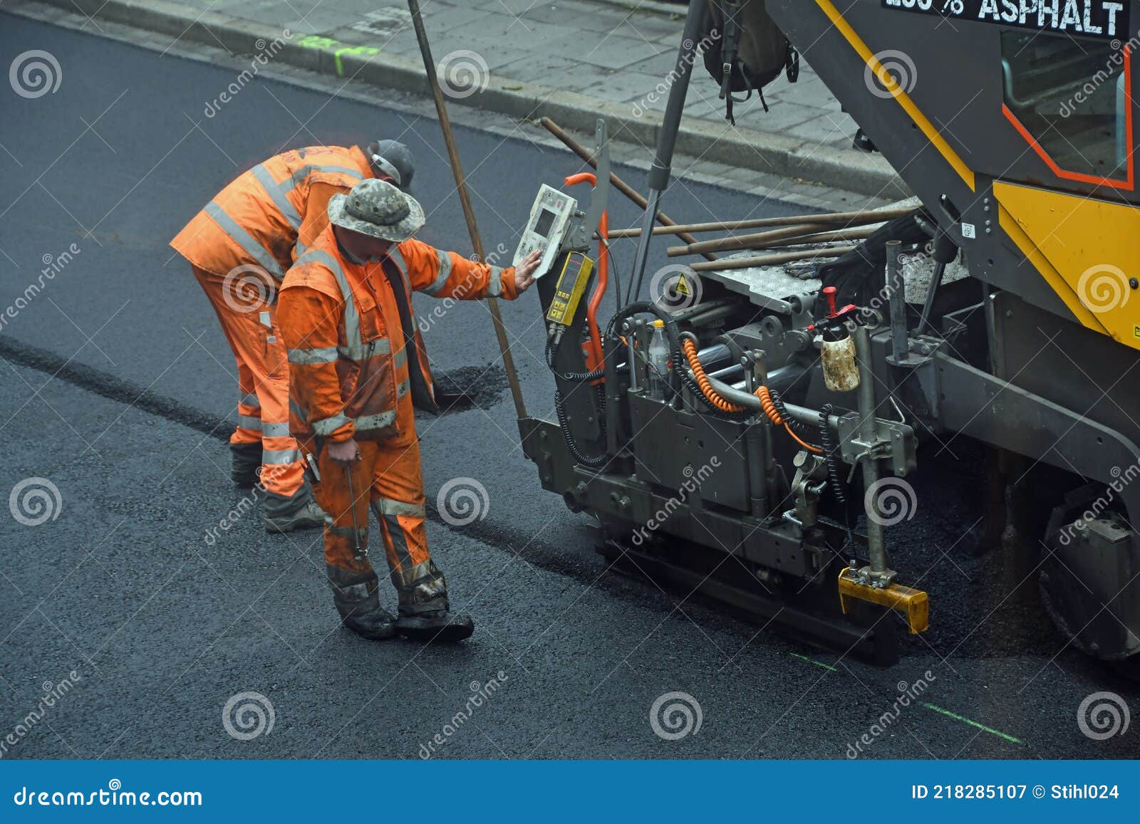 Road Construction Workers Working with Road Paving Machine Editorial ...