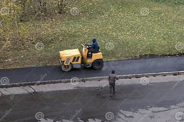 Road Construction Worker Drives Roller Compactor Machine Stock Photo ...