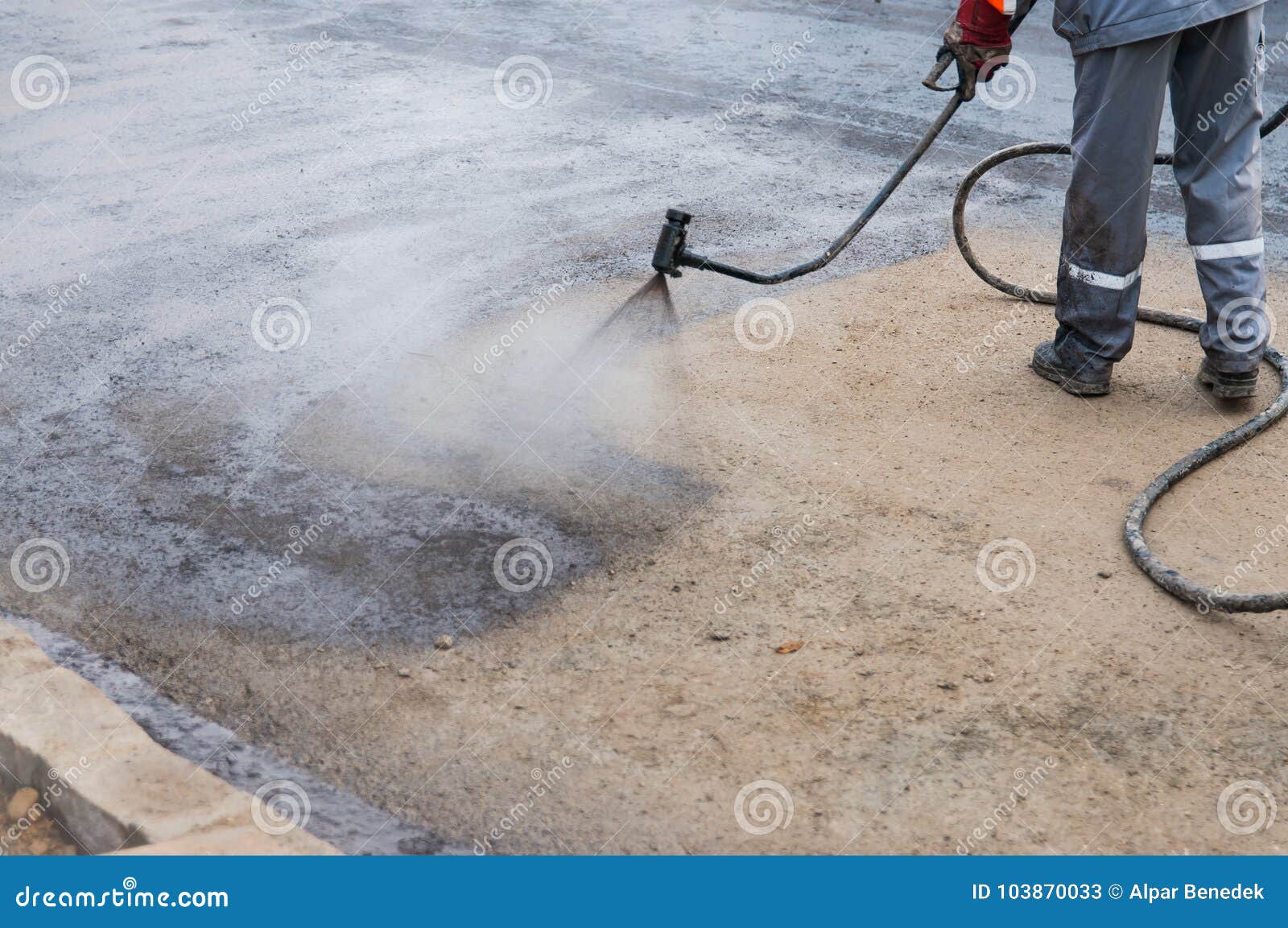 Road Construction Worker Prepares the Soil with Tar. Stock Image ...