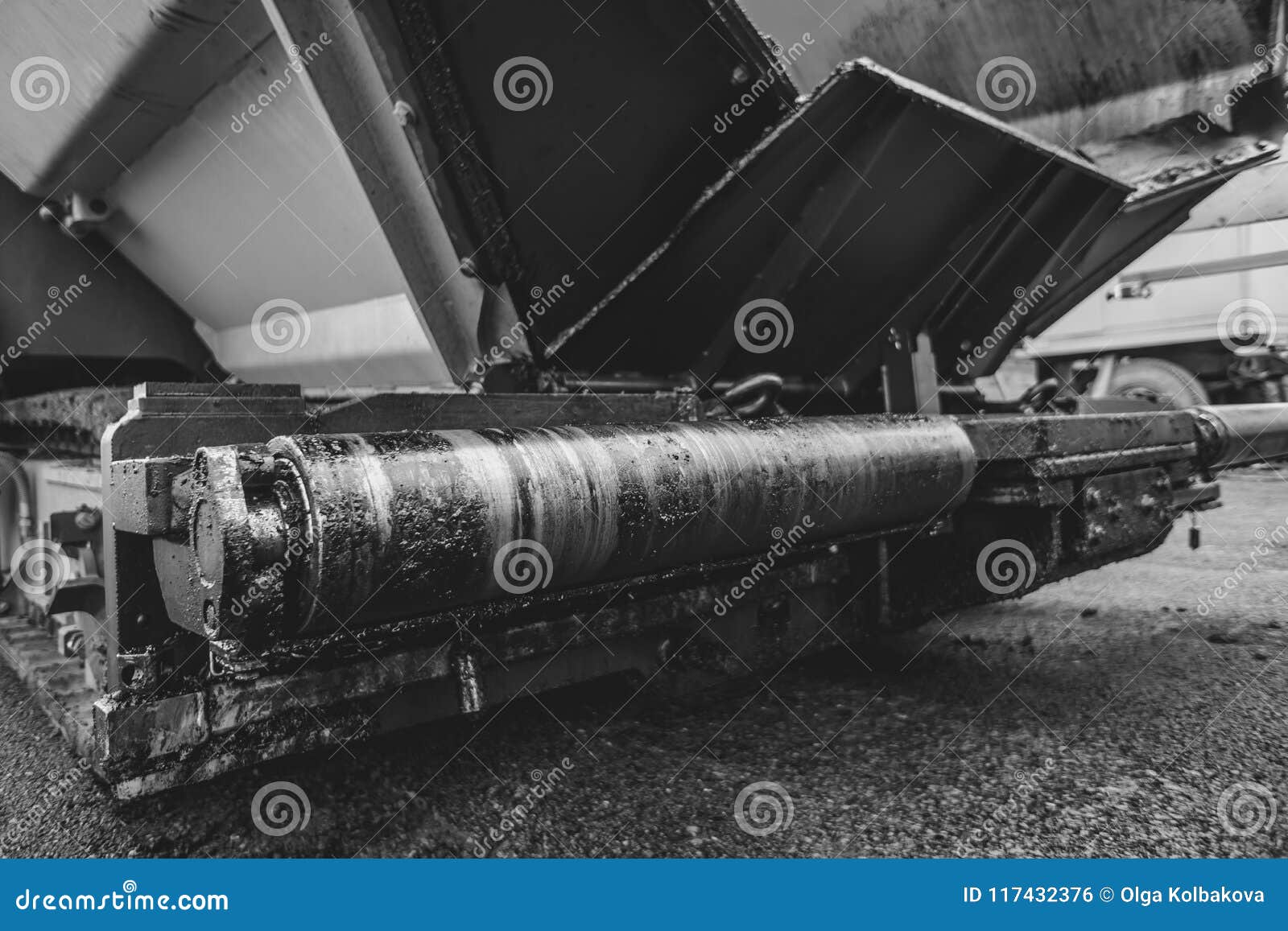 Asphalt laying machines stock photo. Image of cobblestones - 117432376
