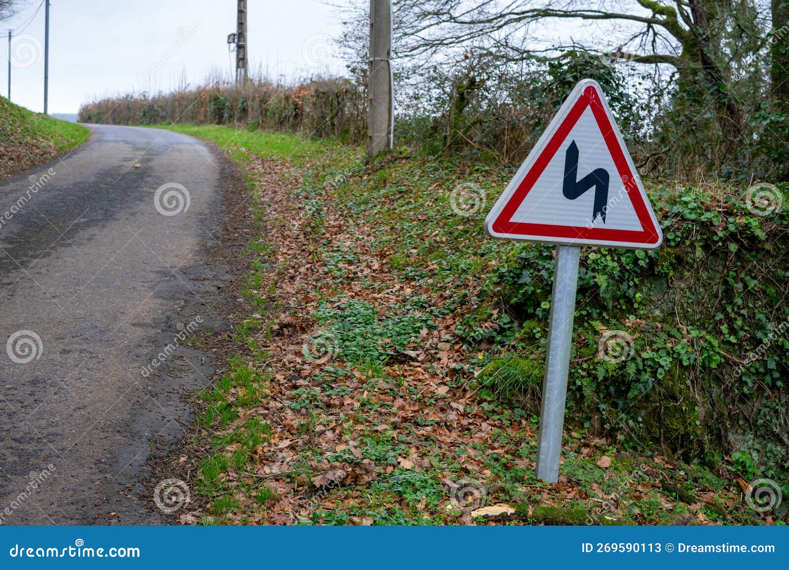 Road in the Countryside and a Sign of Several Turns. Warning Sign for ...