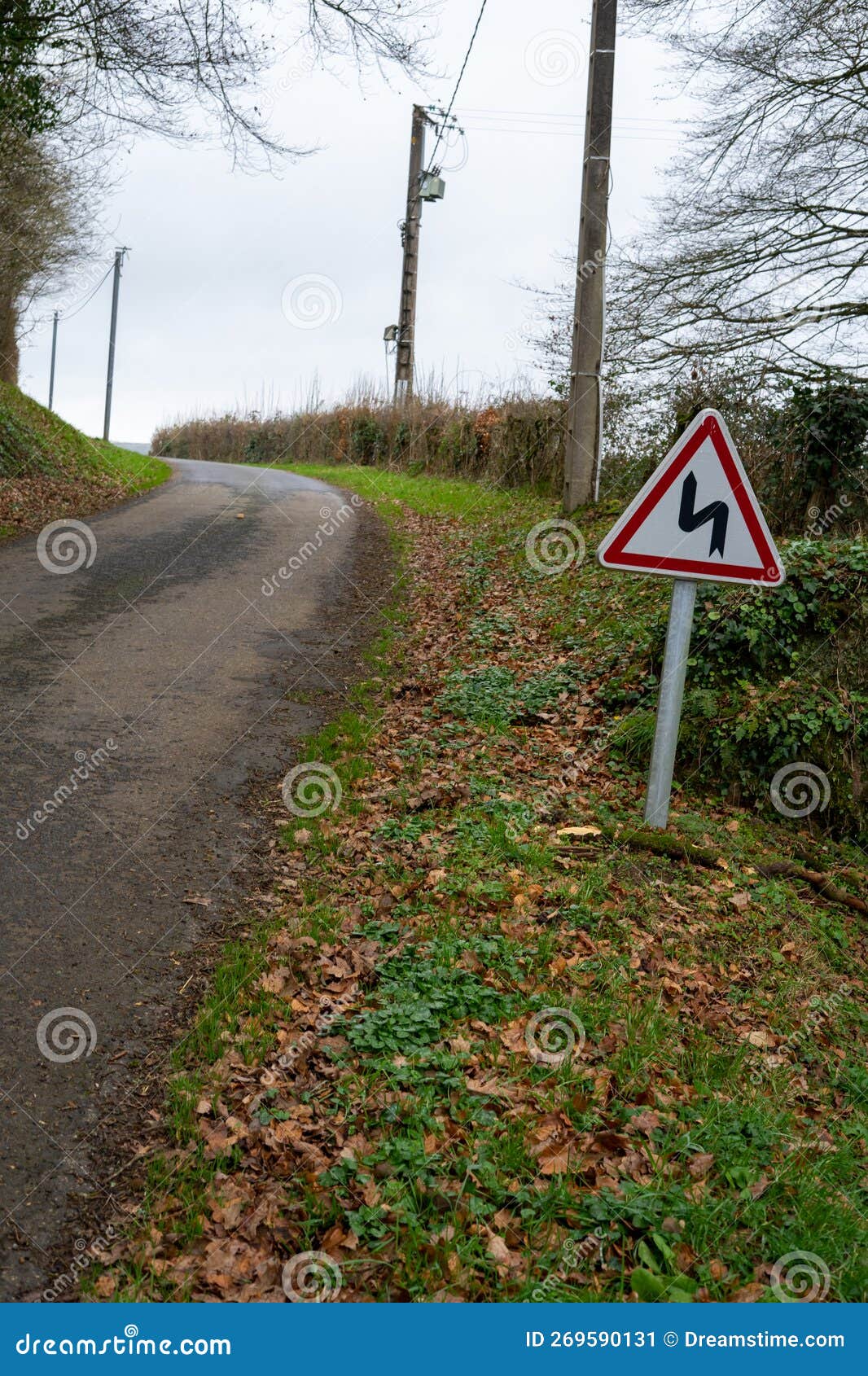 Road in the Countryside and a Sign of Several Turns. Warning Sign for ...