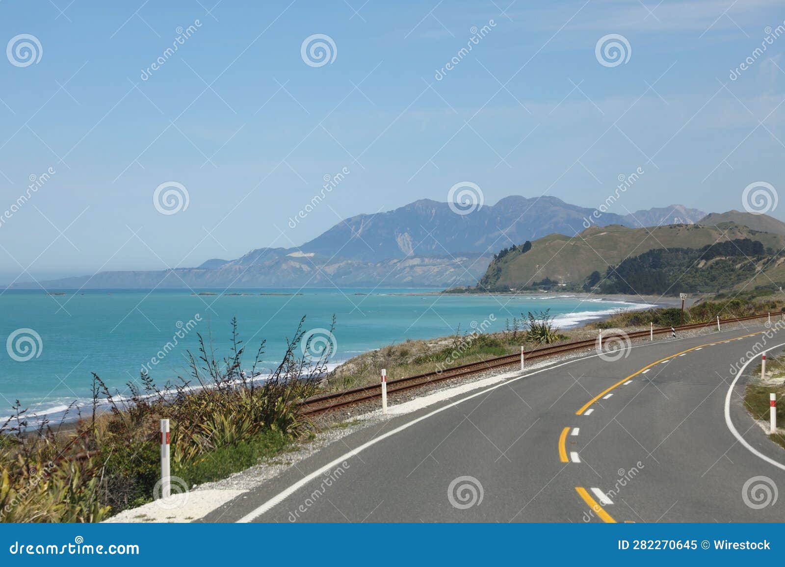 The Road is Empty on the Side of the Mountain beside the Ocean Stock ...