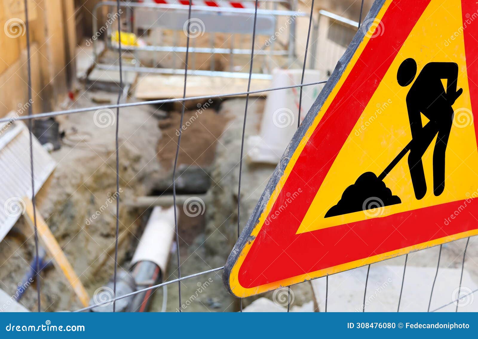Road Excavation and the Caution Work in Progress Sign Stock Photo ...