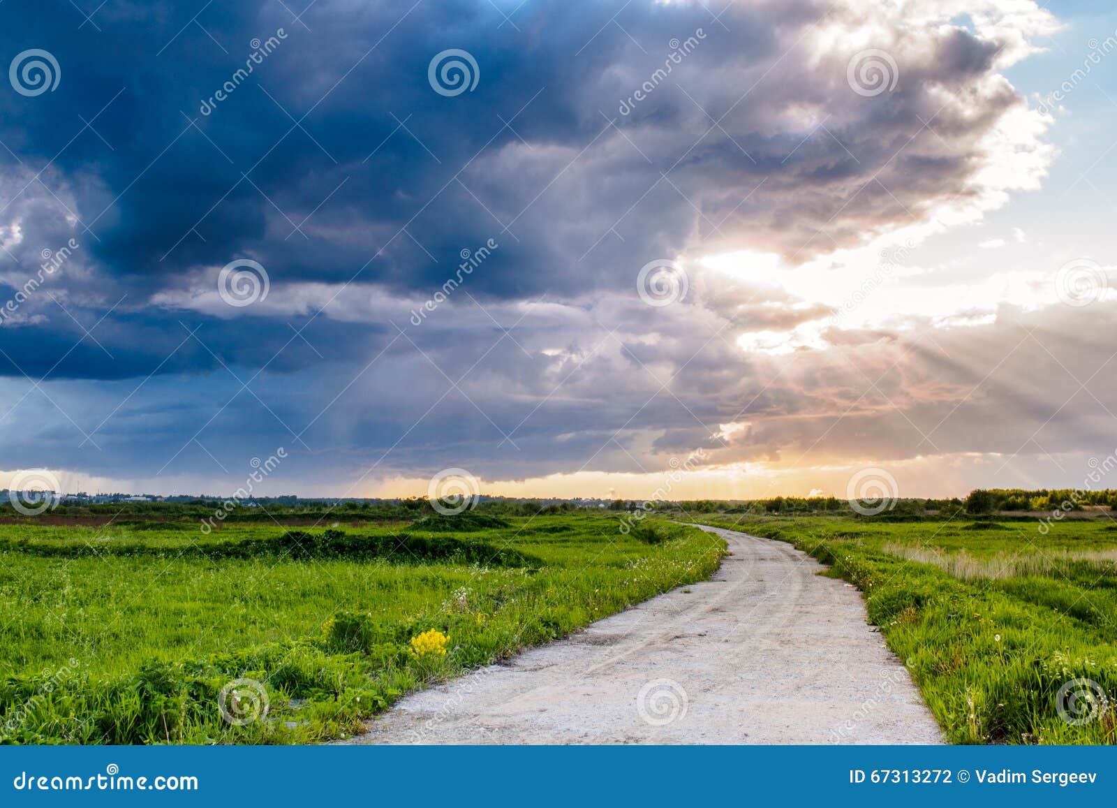 Road through the field stock photo. Image of grass, clouds - 67313272