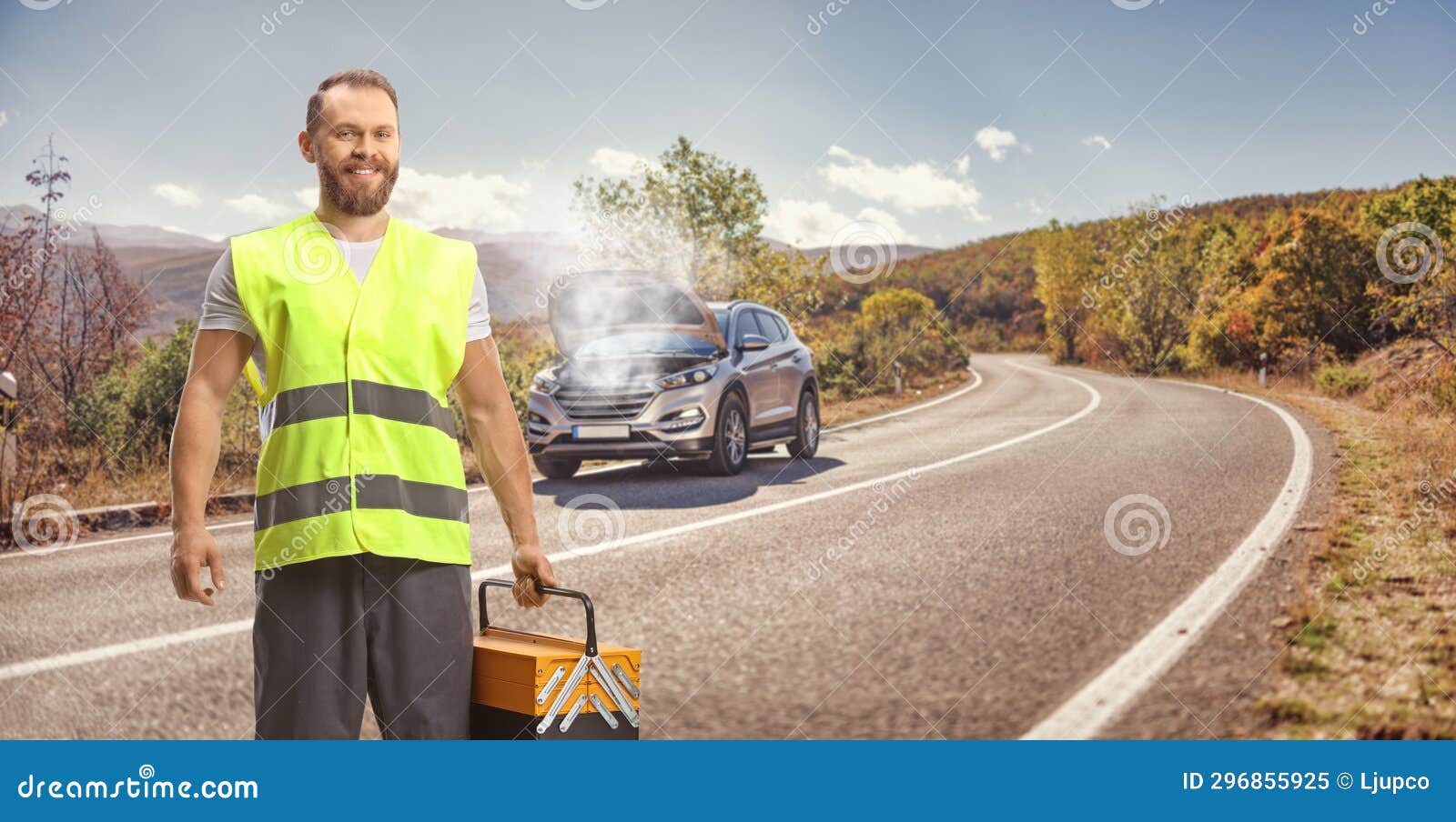 Road Help Worker Holding a Tool Box and Smiling on the Road Stock Image ...