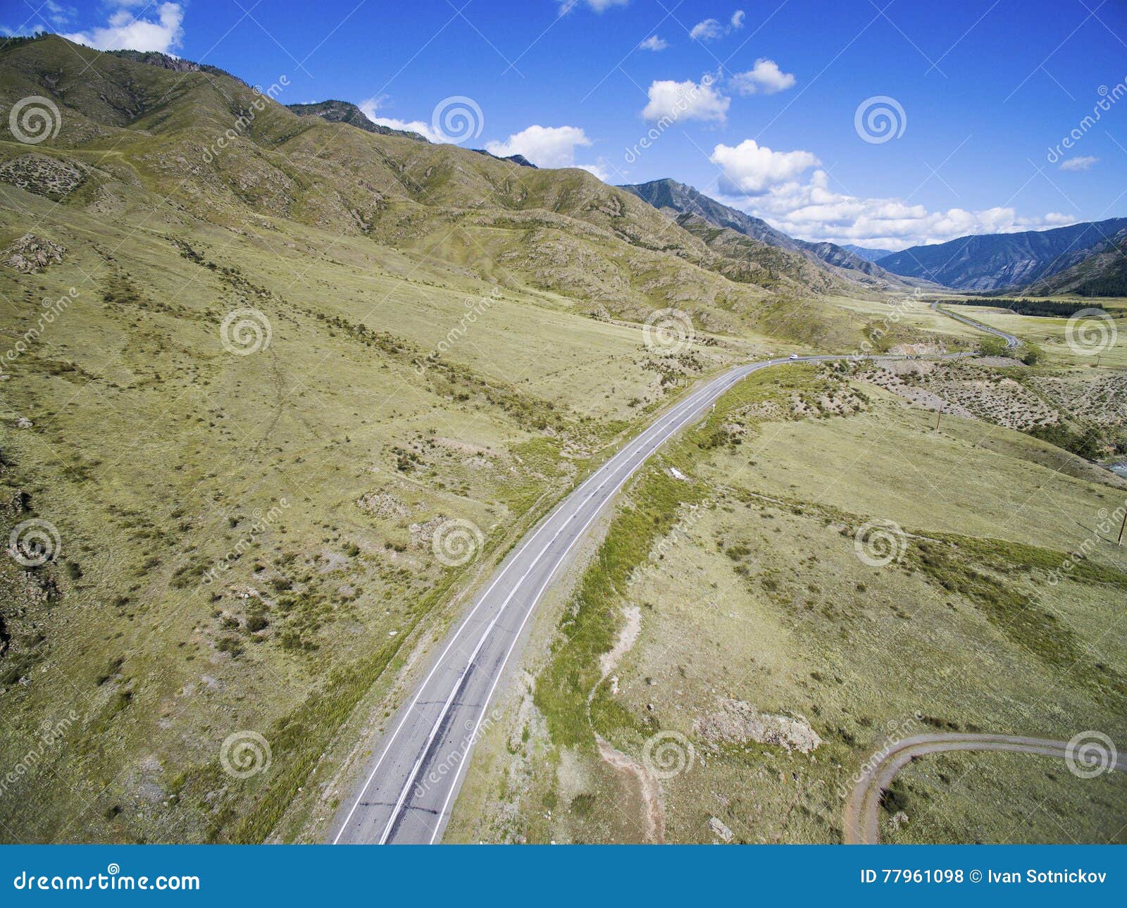 The road on the hillside stock photo. Image of mountainside - 77961098
