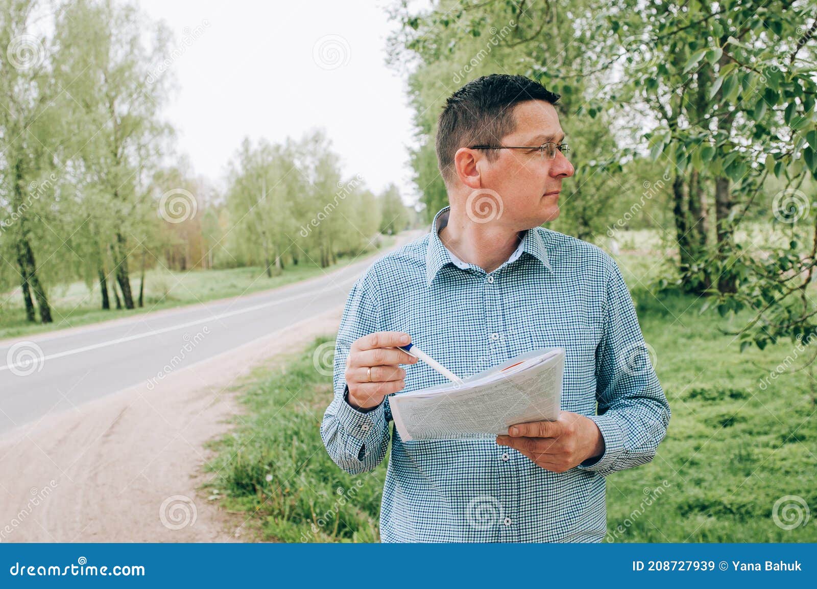 The Road Inspector on a Working Platform. Stacking of New Asphalt Stock ...