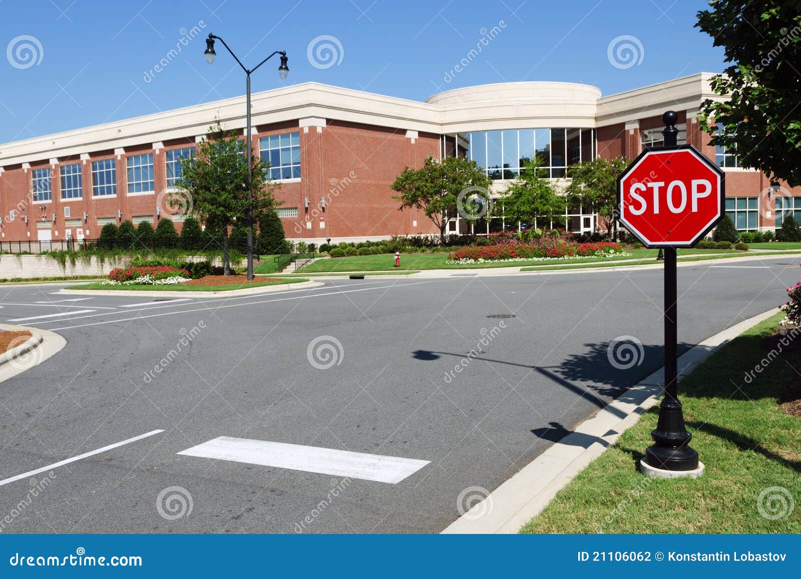 Road Intersection with Stop Sign Near Office Stock Photo - Image of ...