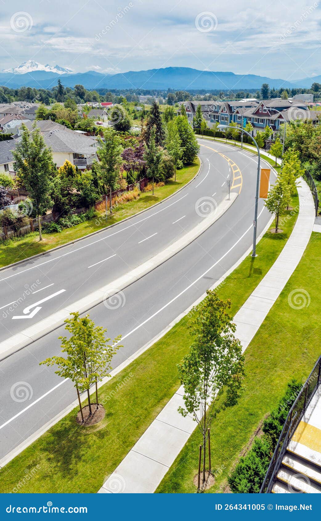 Road Leading through Residential Area with Mountain View on Skyline ...