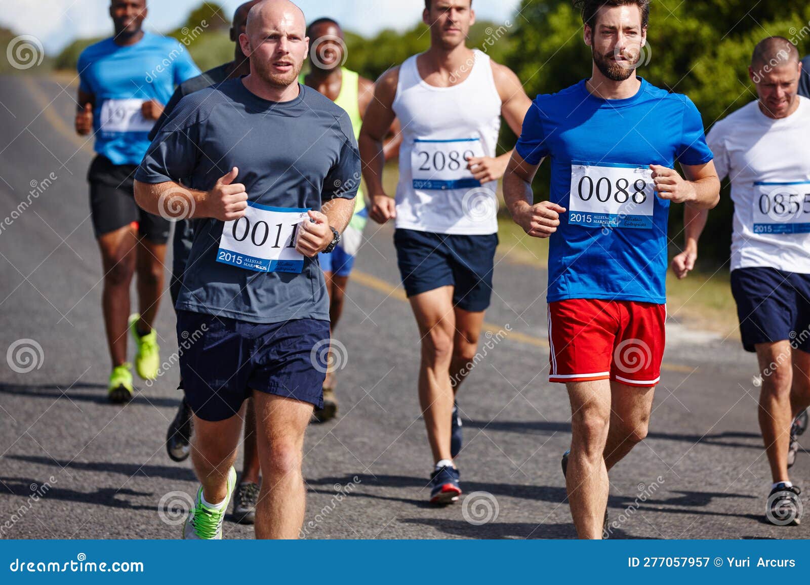 The Road is Long. a Group of Young Men Running a Marathon. Stock Image ...