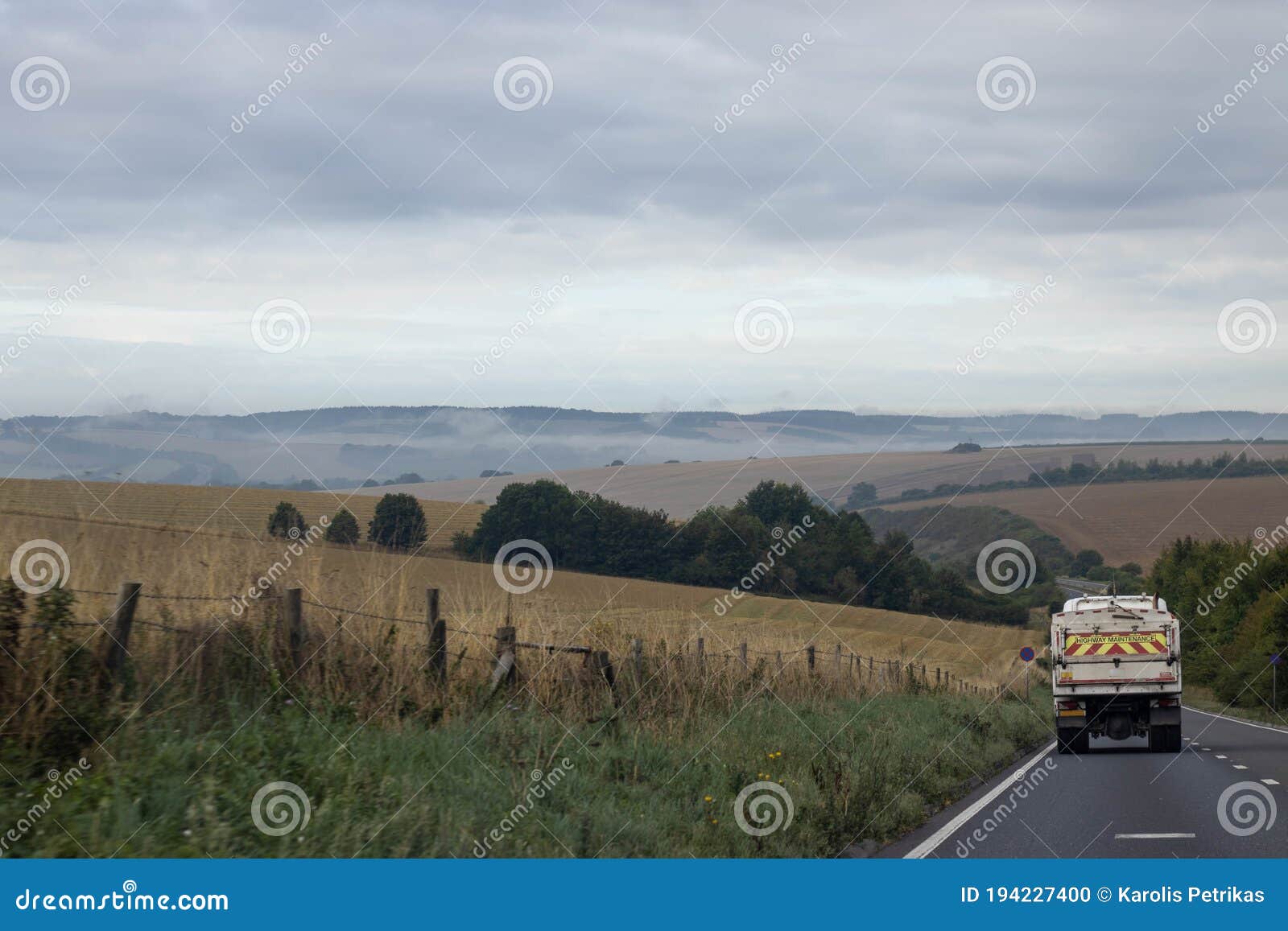 Road Maintenance Truck on a Rural Road Stock Photo - Image of asphalt ...