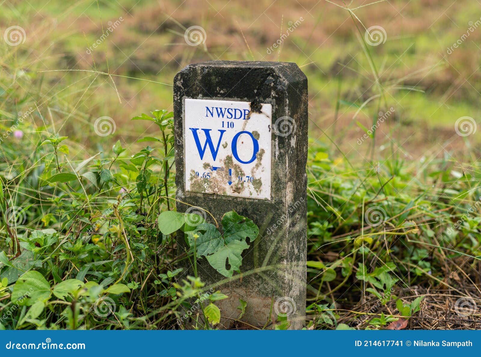 Road Milestone and Information on an Old Concrete Post Weathered in the ...