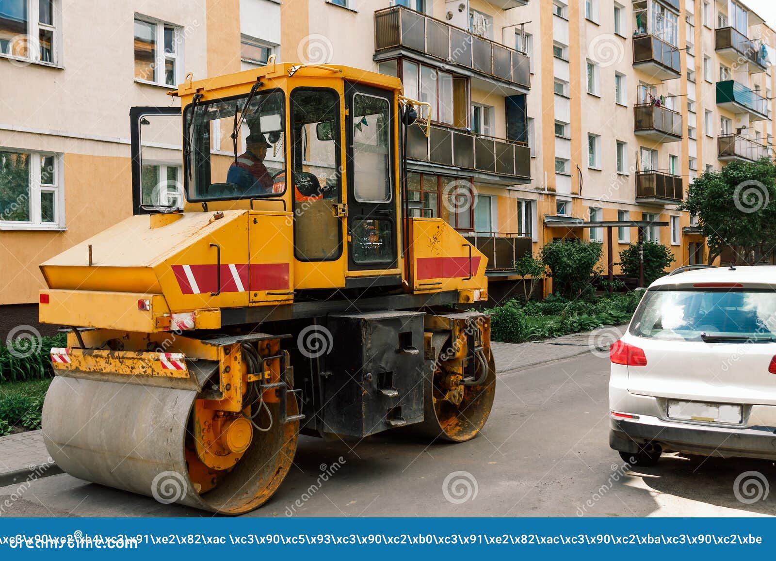 Road Roller With Spikes And Truck Plate Compactor Are Working At ...
