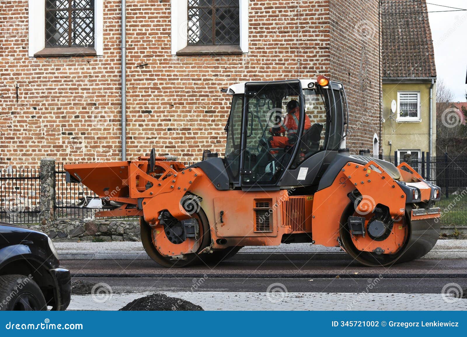 A Road Roller Compacting Asphalt during Operation. Stock Photo - Image ...