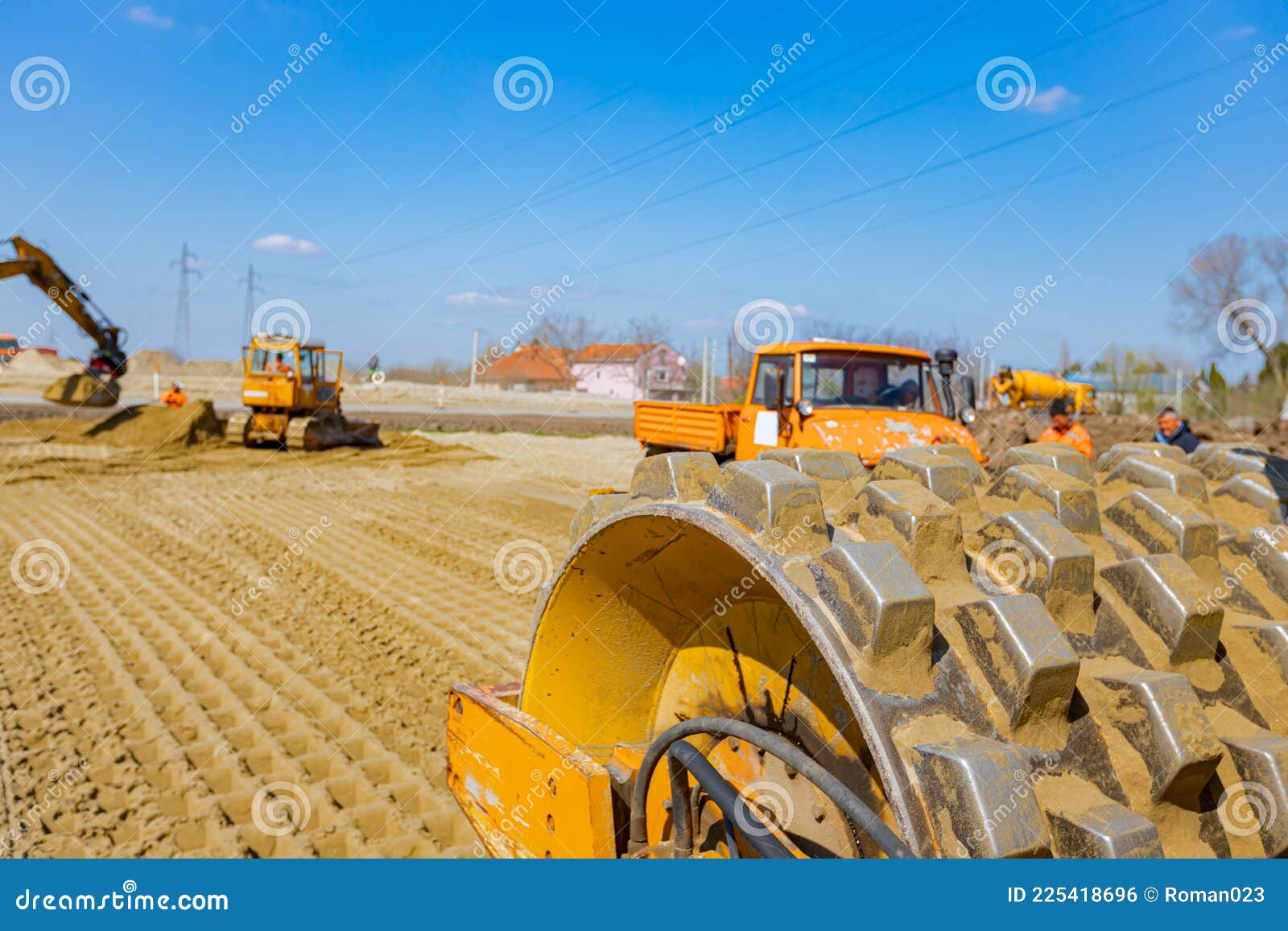Road Roller with Spikes is Working at Construction Site Stock Photo ...