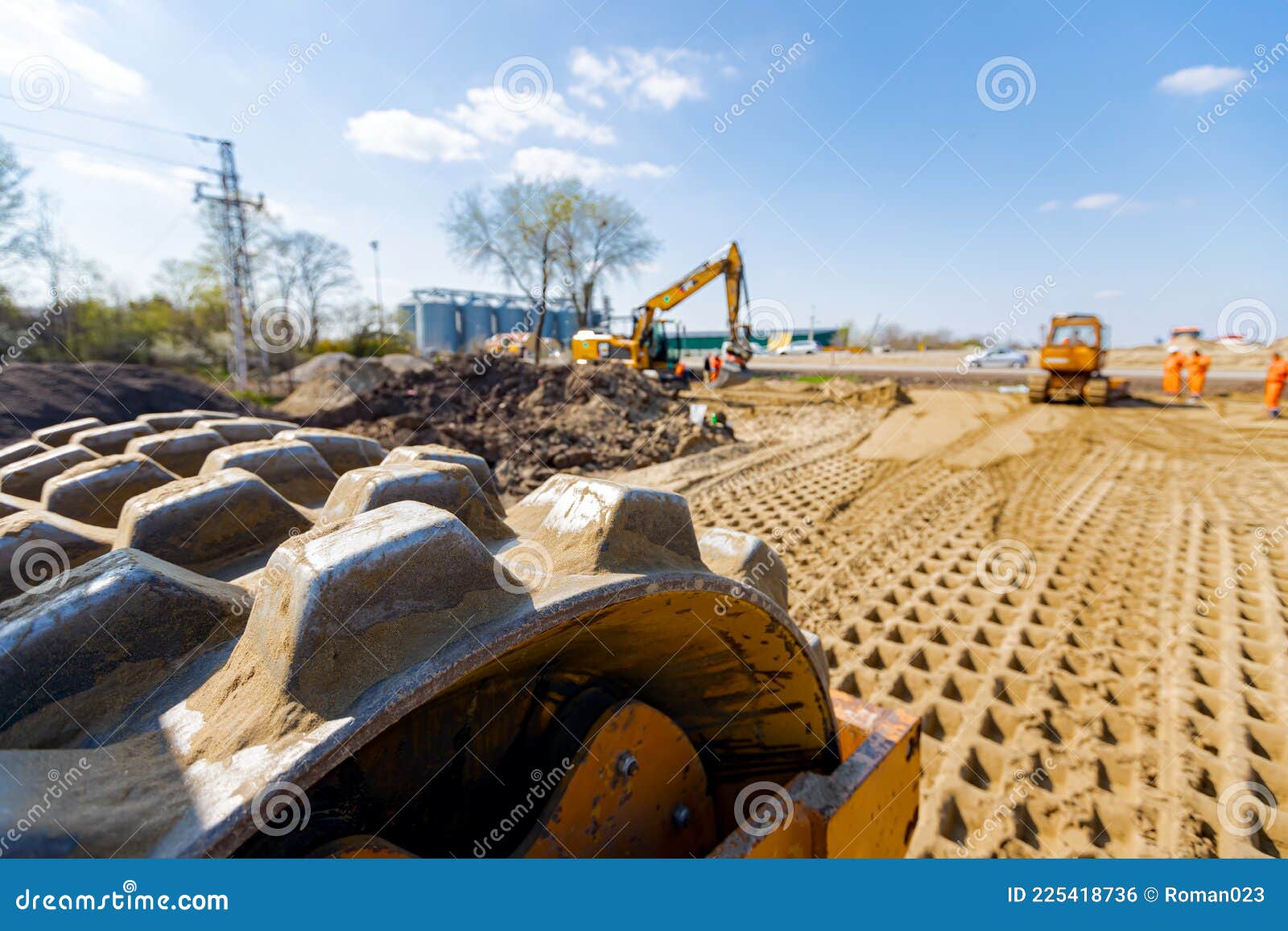 Road Roller with Spikes is Working at Construction Site Stock Photo ...