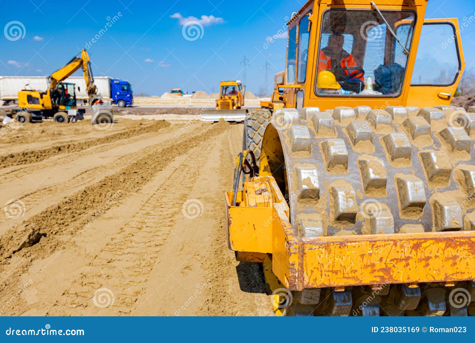Road Roller with Spikes is Working at Construction Site Stock Image ...