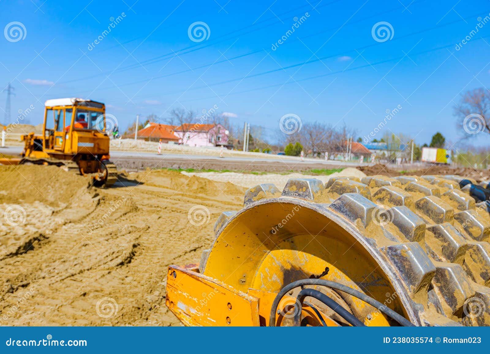 Road Roller with Spikes is Working at Construction Site Stock Photo ...