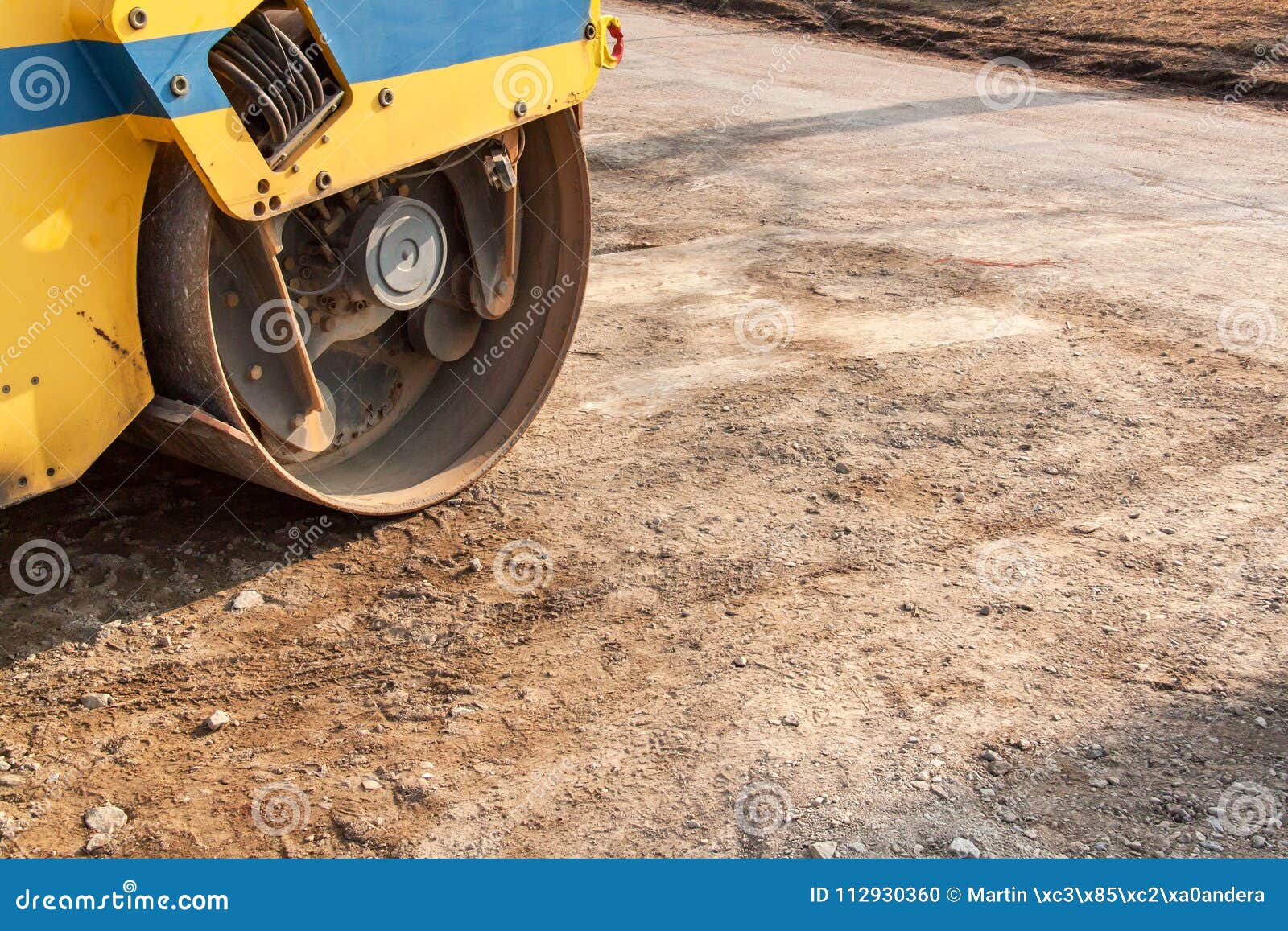 Road Roller Working at Road Construction Site. Detailed View of a Road ...