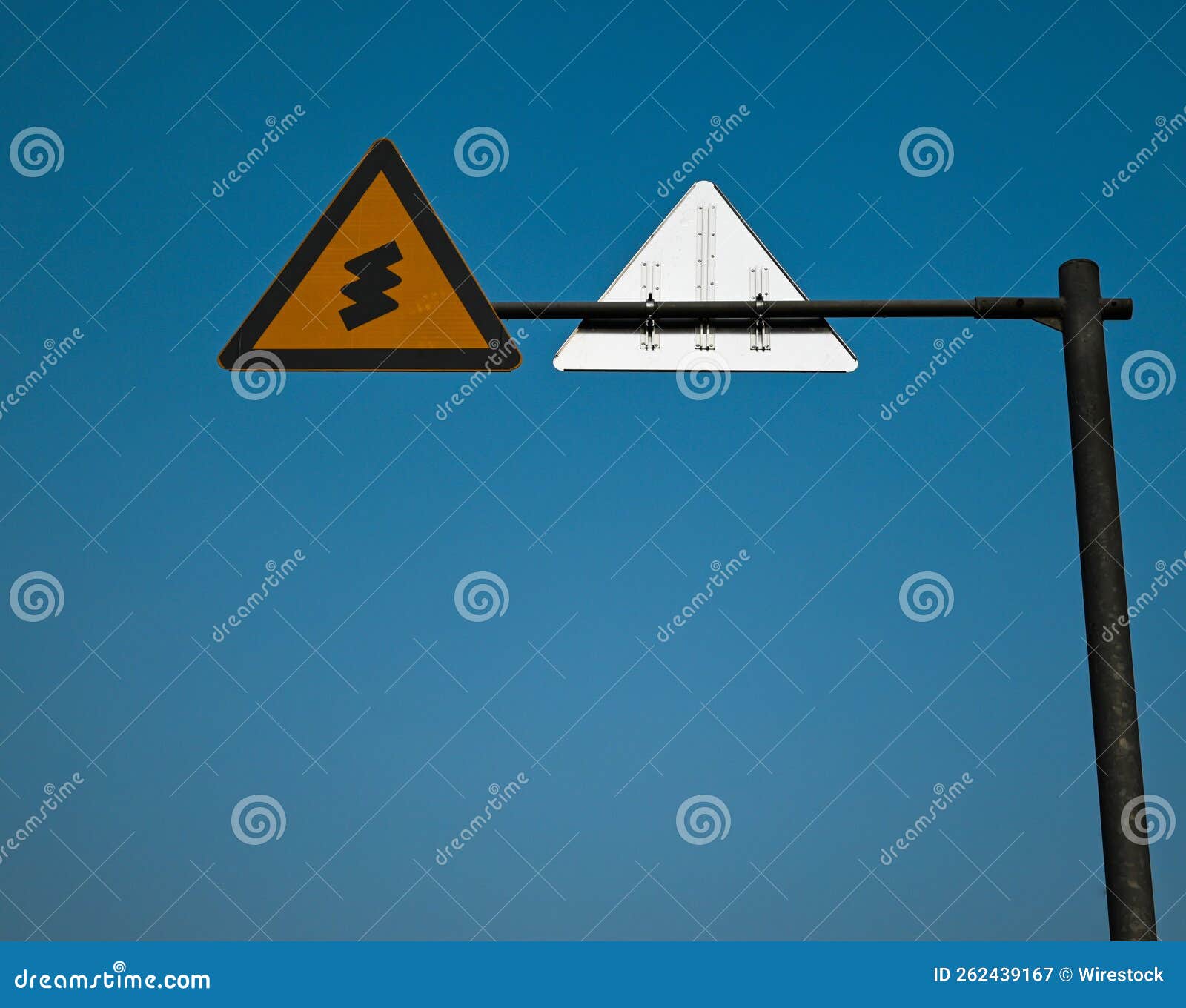 Road Safety Warning Sign on a Background of Clear Blue Sky Stock Image ...