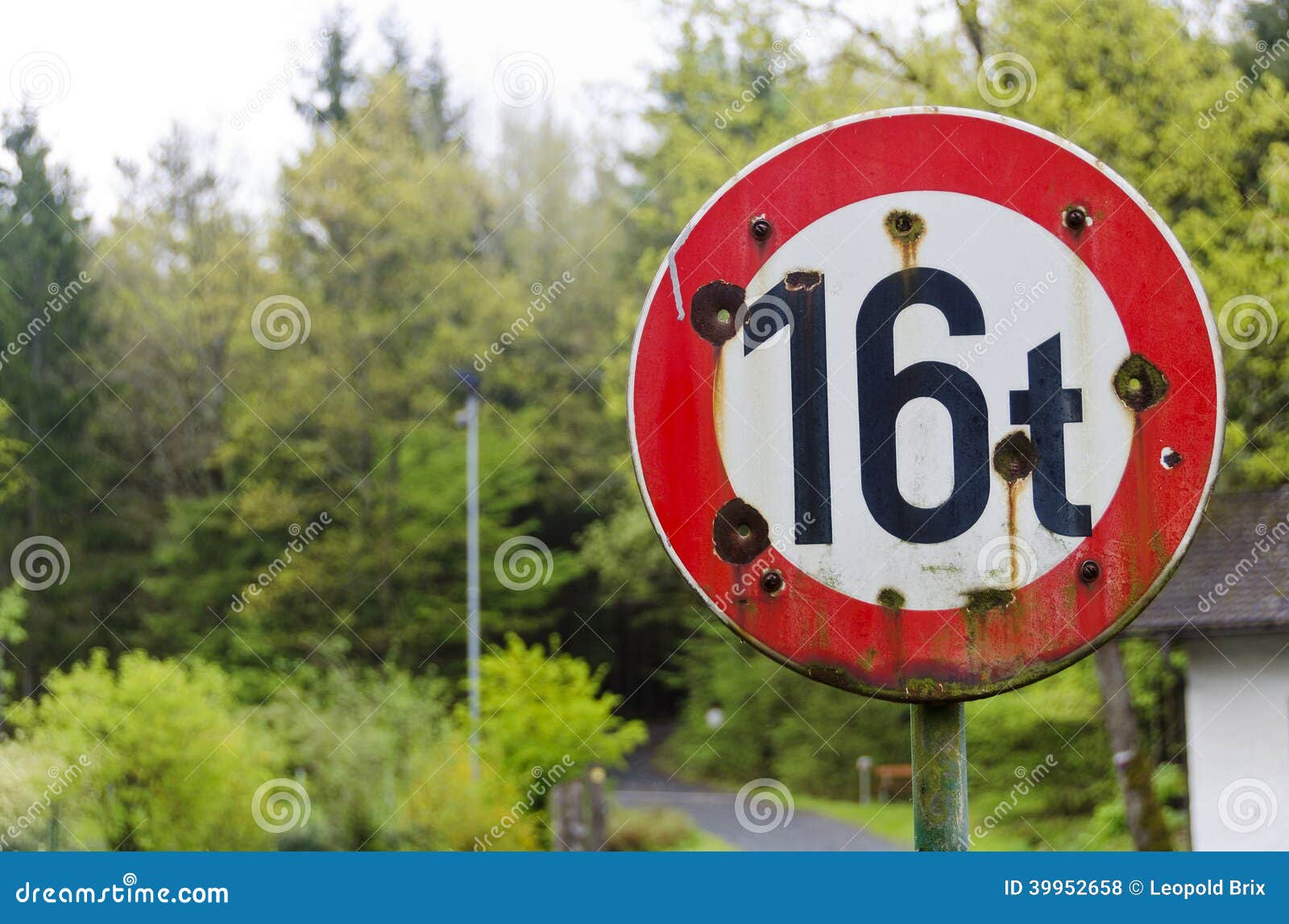 Road Sign with Bullet Holes Stock Photo - Image of rules, traffic: 39952658