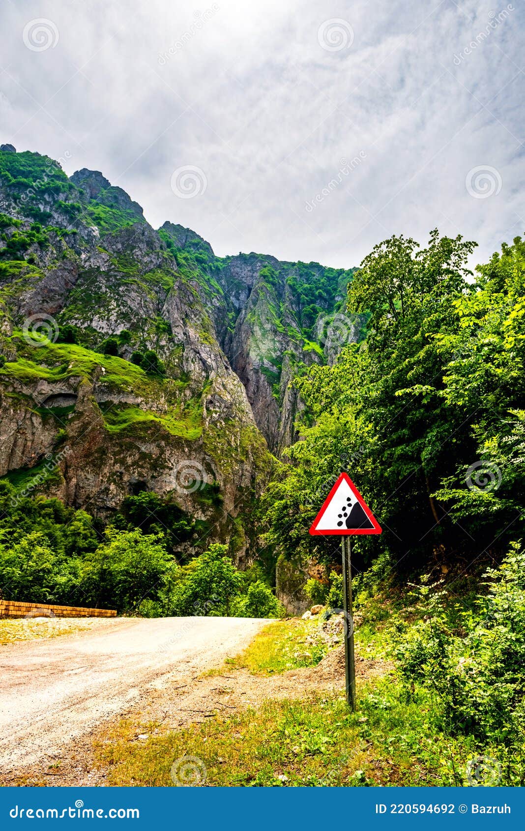 Road Sign Falling Stones on Road. Traffic Sign Caution Possible Falling ...