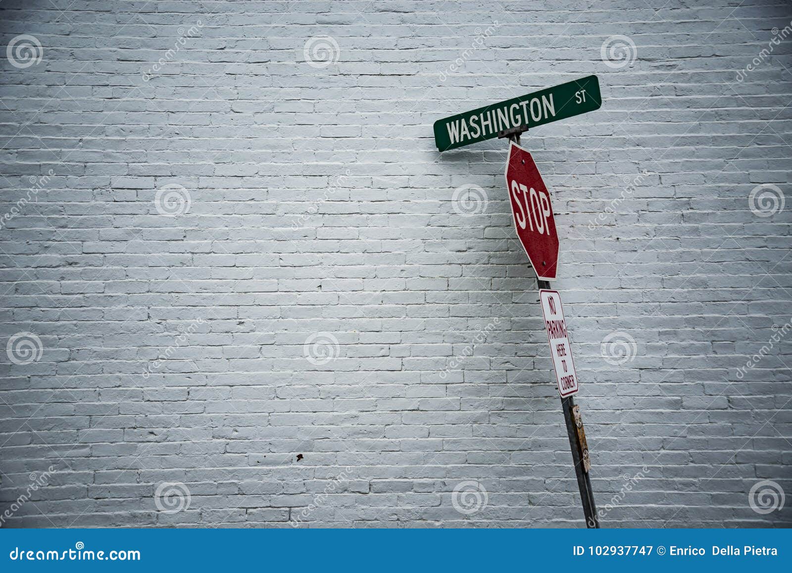 Road Sign in Front of a White Wall Stock Image - Image of road, space ...