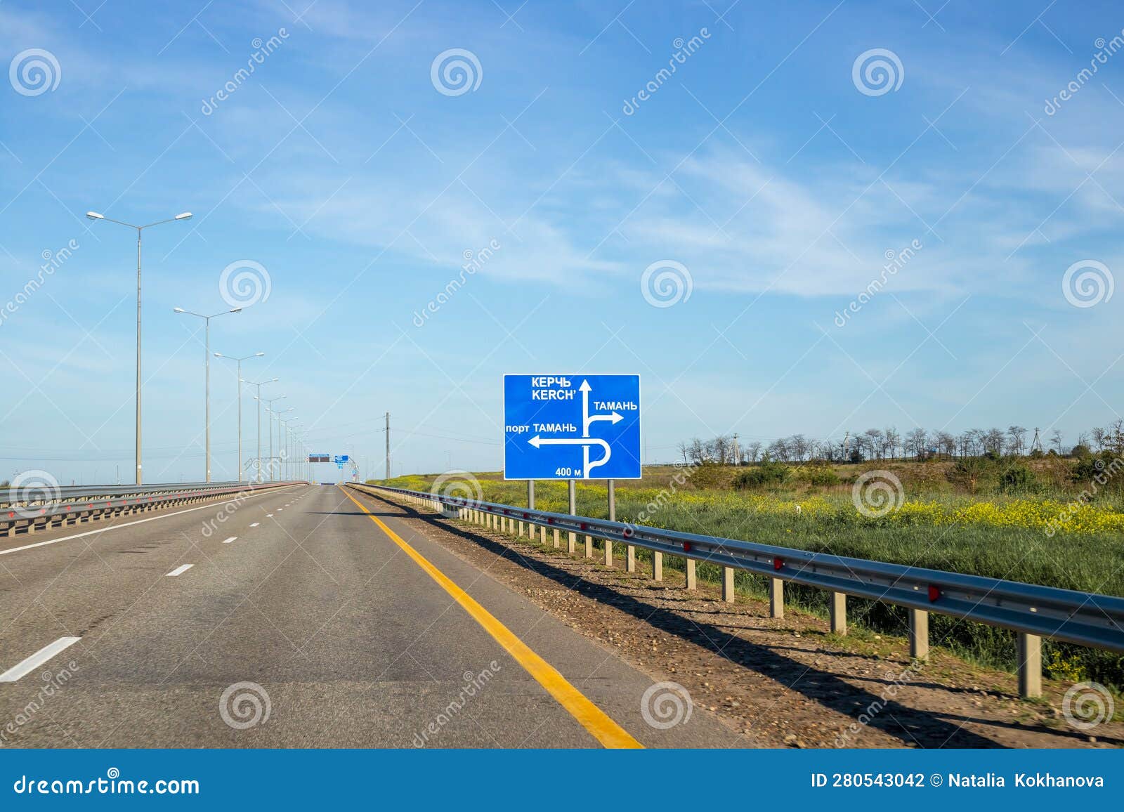 Road with a Sign and an Inscription of the Direction of Movement and ...