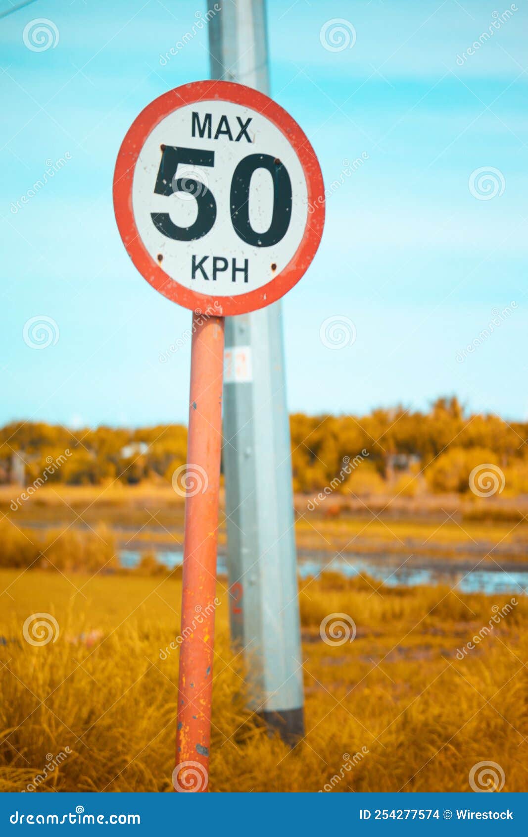 Road Sign with a Maximum of 50 KPH Limit Against a Blurred Background ...