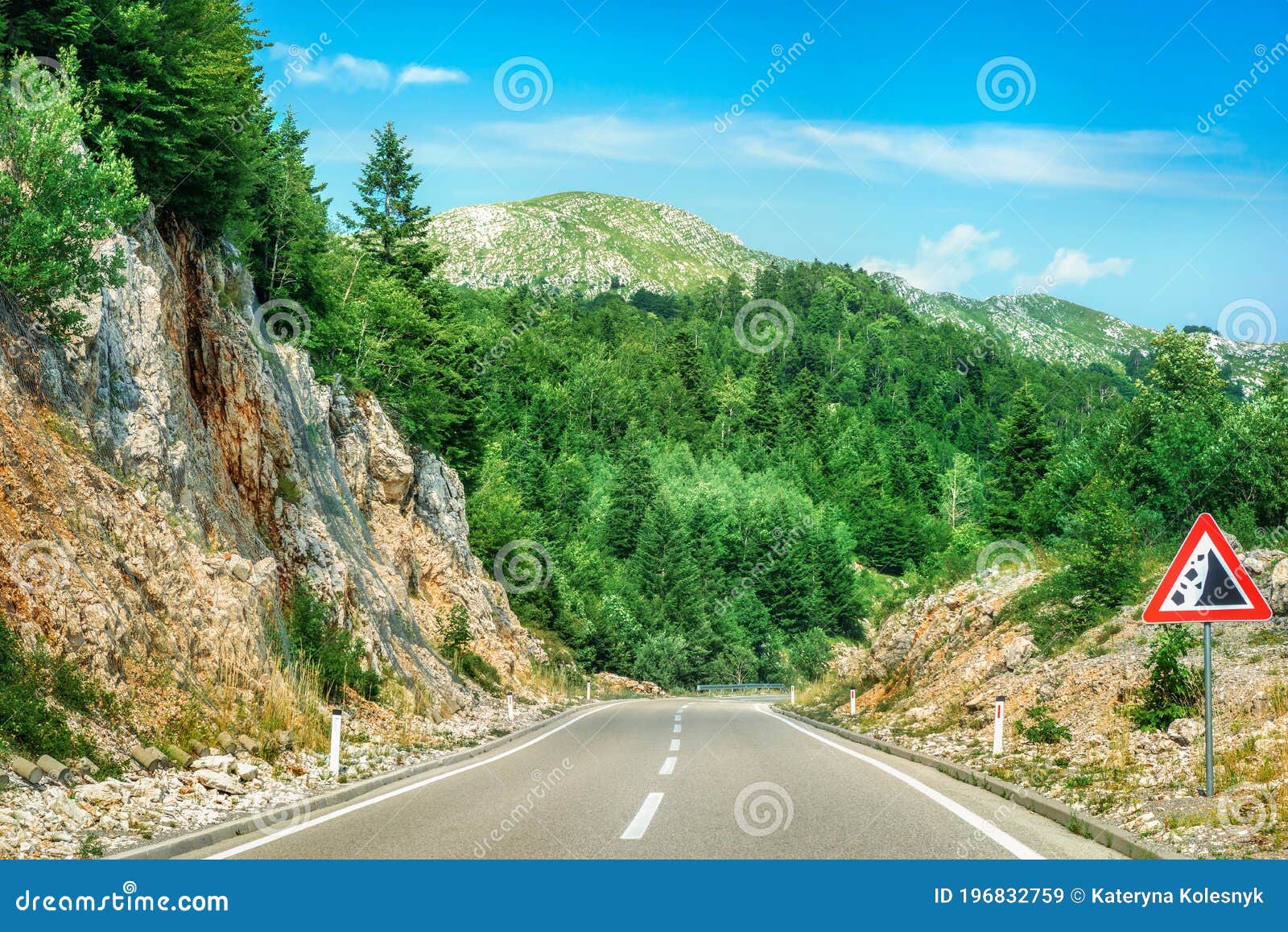 Road sign in mountains stock image. Image of dividing - 196832759