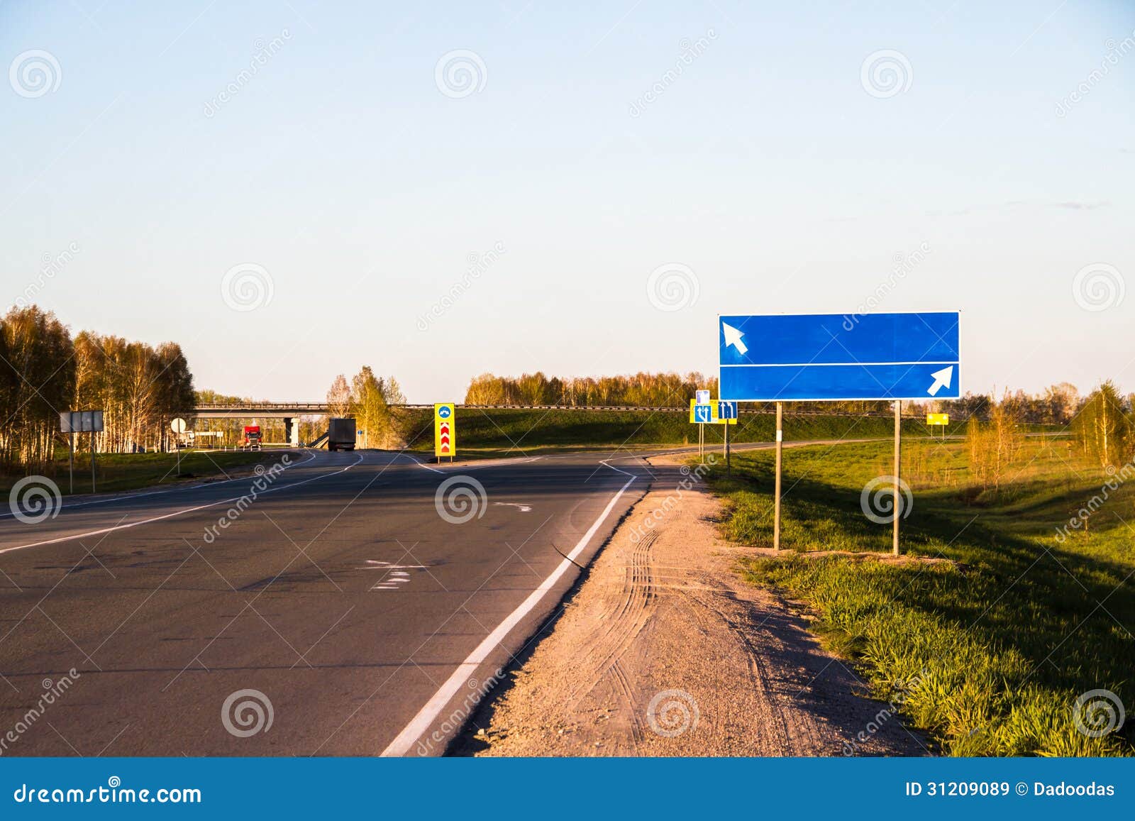 Road with Sign Pole and Blue Sky with Clouds Stock Image - Image of ...
