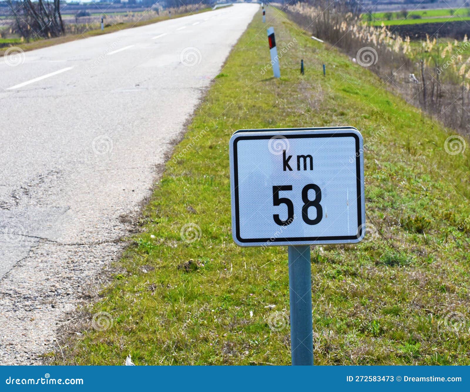 Road Sign that Shows Road Mileage Stock Image - Image of hour, grass ...