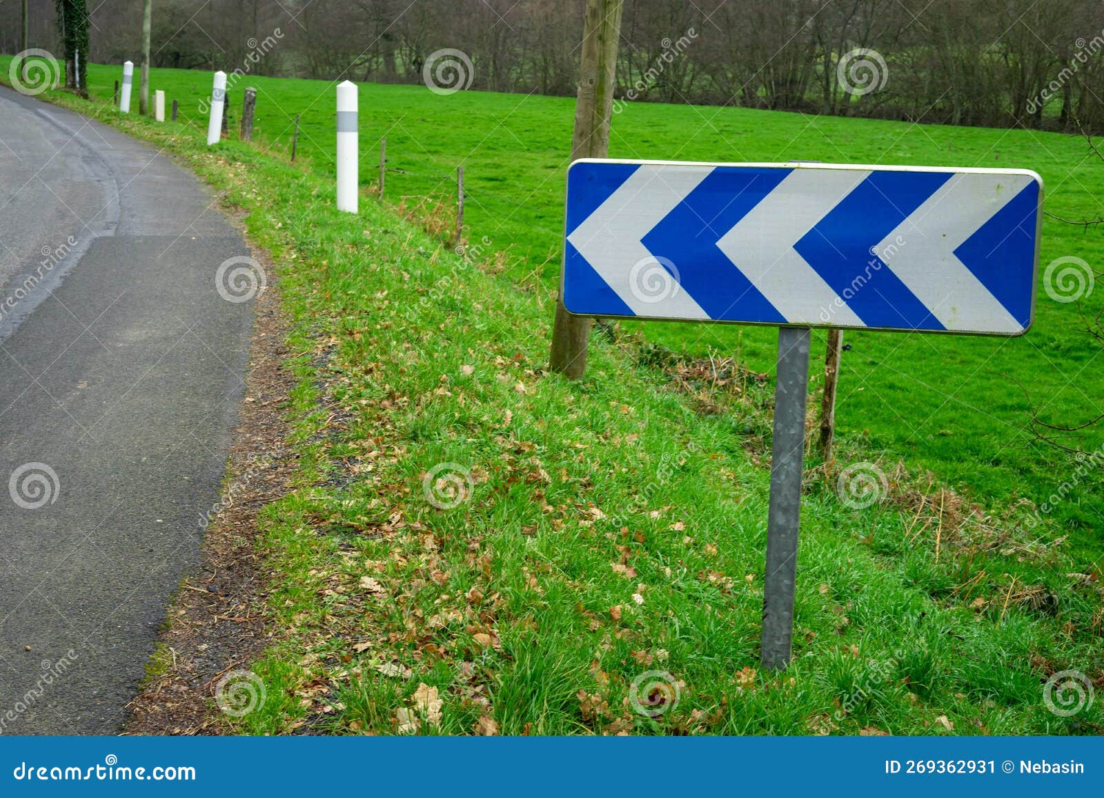 Road and Road Sign Warning about a Turn in the Road. Road Safety ...