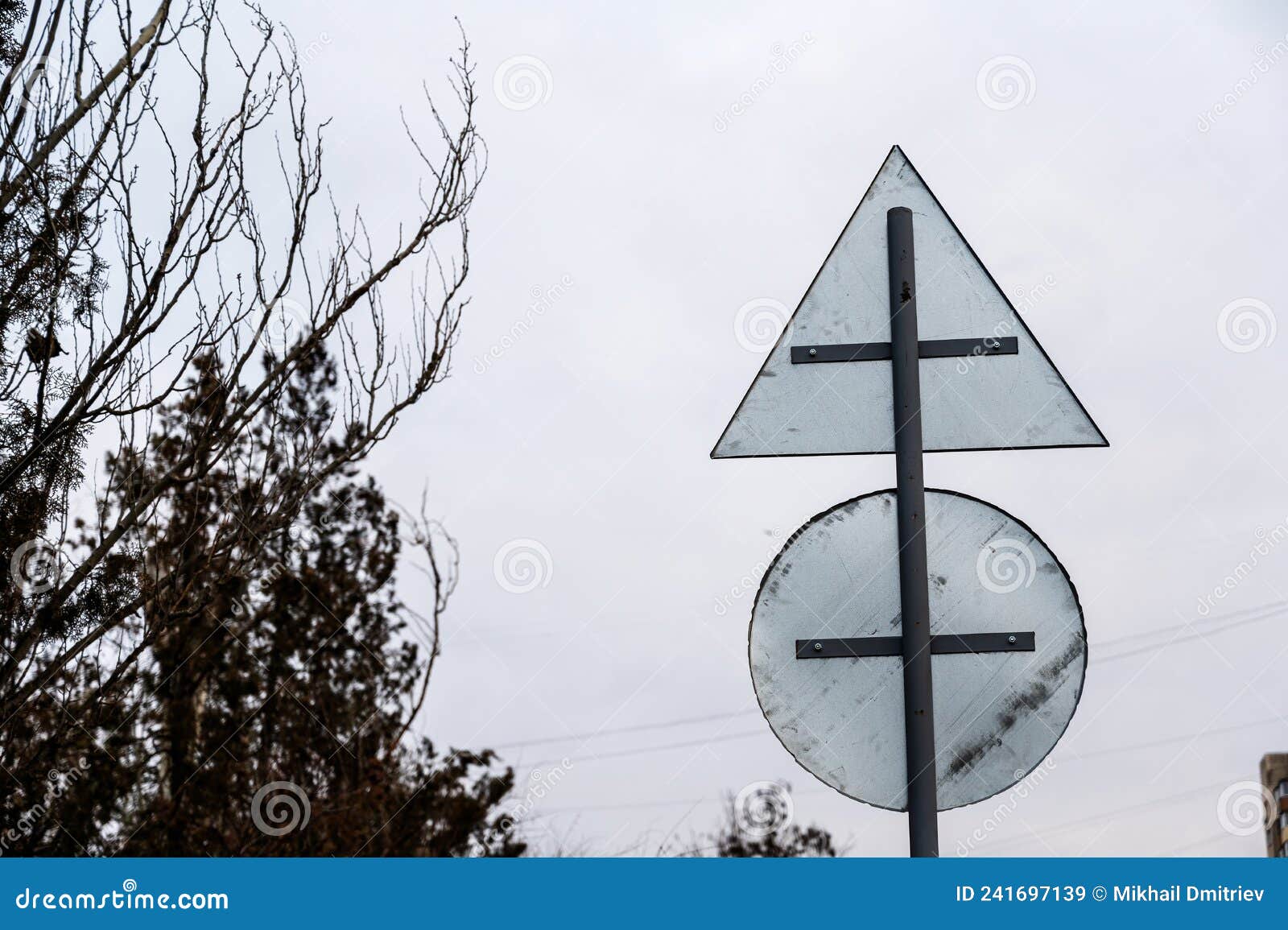 Road Signs, Backside. Circular and Triangular Sign Opposite Overcast ...