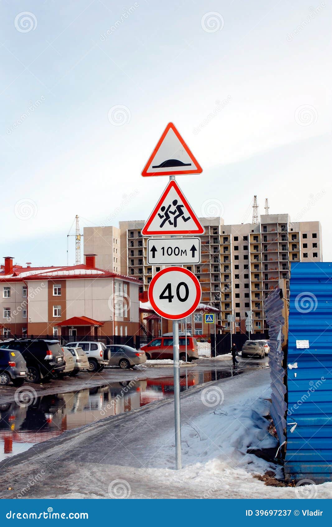Road Signs in the Spring Town Stock Image - Image of puddle, asphalt ...