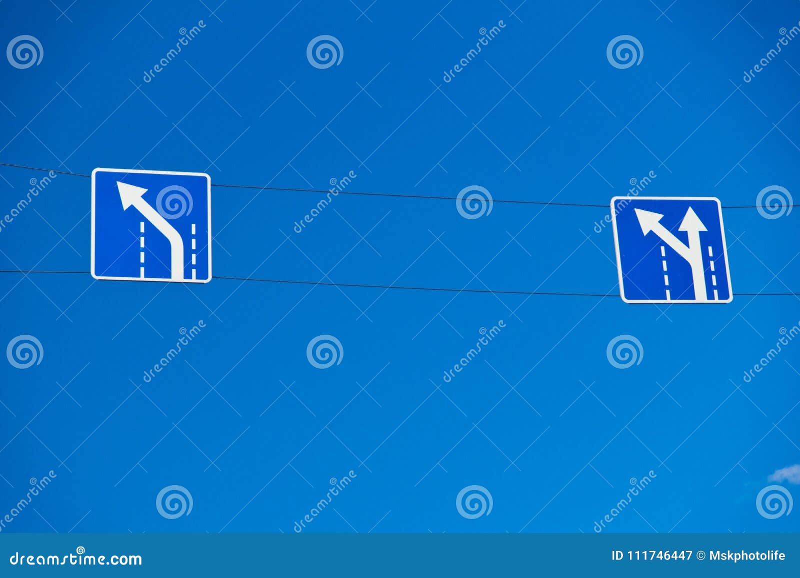 Road signs on wire and sky stock image. Image of wires - 111746447