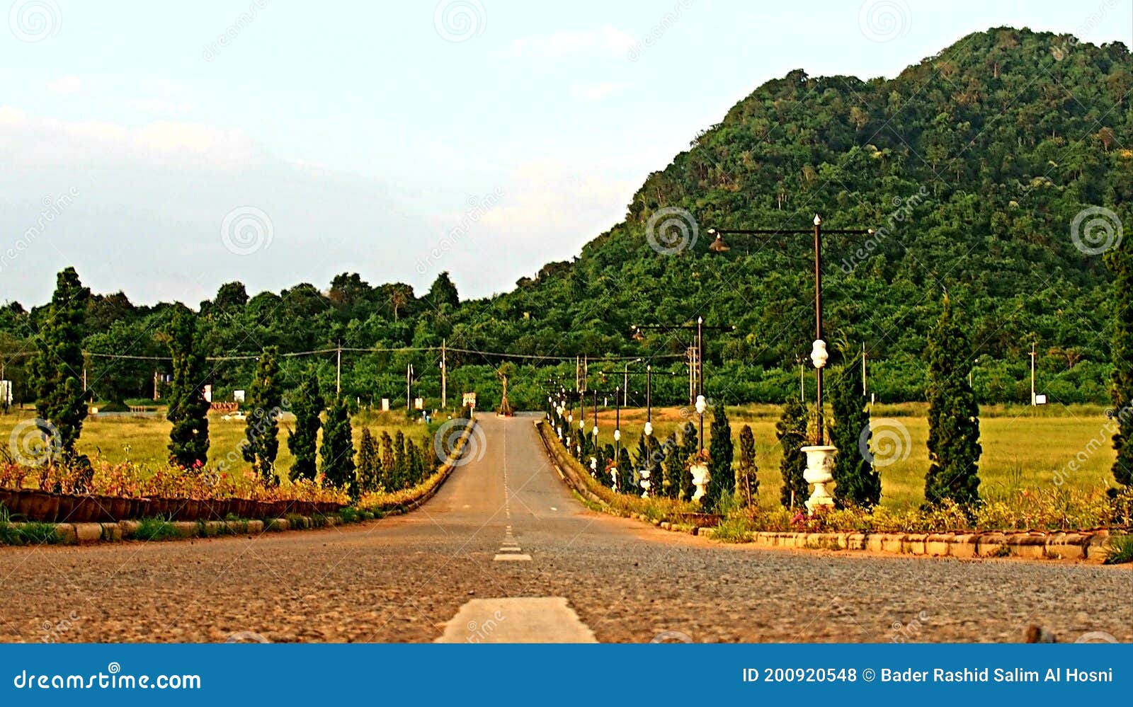A Road Surrounded by Landscaped Gardens Stock Photo - Image of town ...
