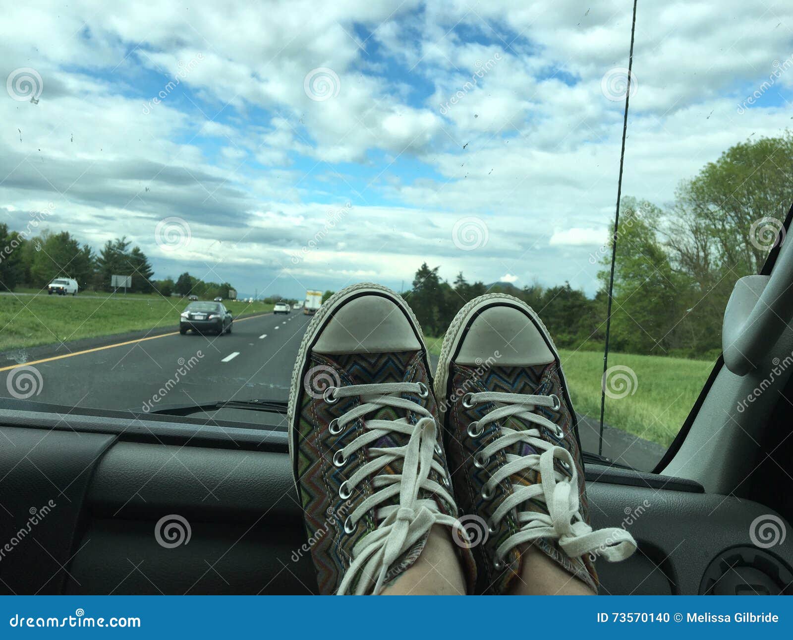 Road tripping stock photo. Image of clouds, dash, sneakers - 73570140