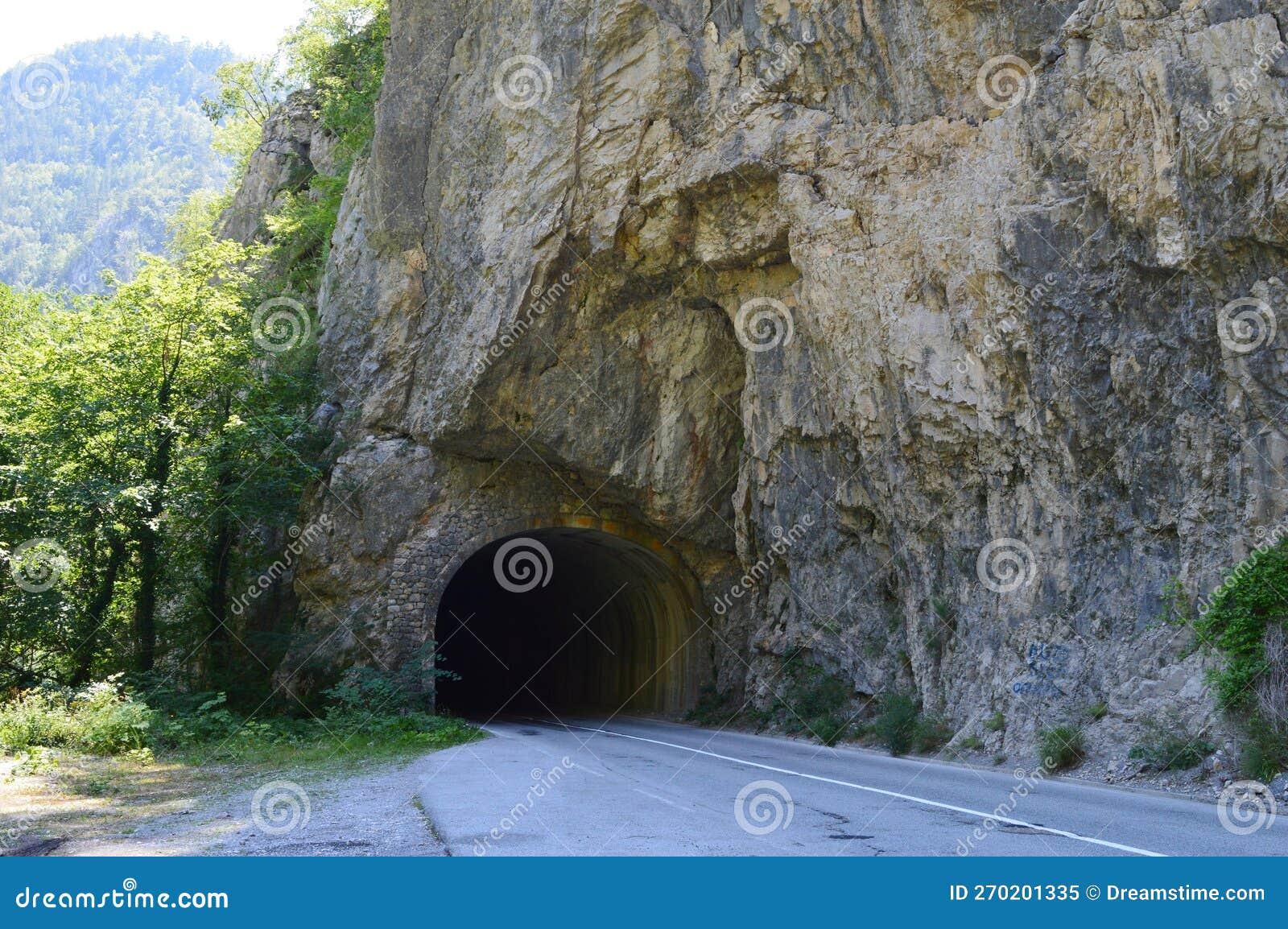Road tunnel in the rock stock image. Image of geology - 270201335