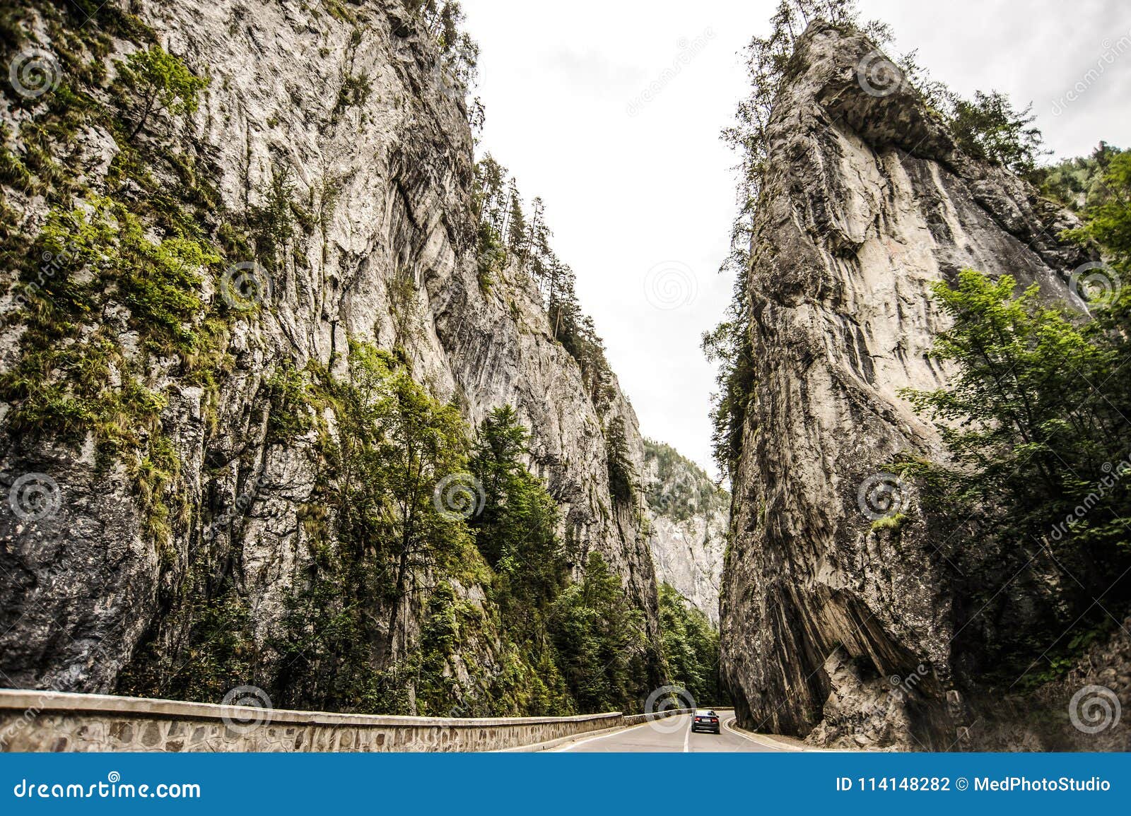 Road between two mountain stock photo. Image of rock - 114148282