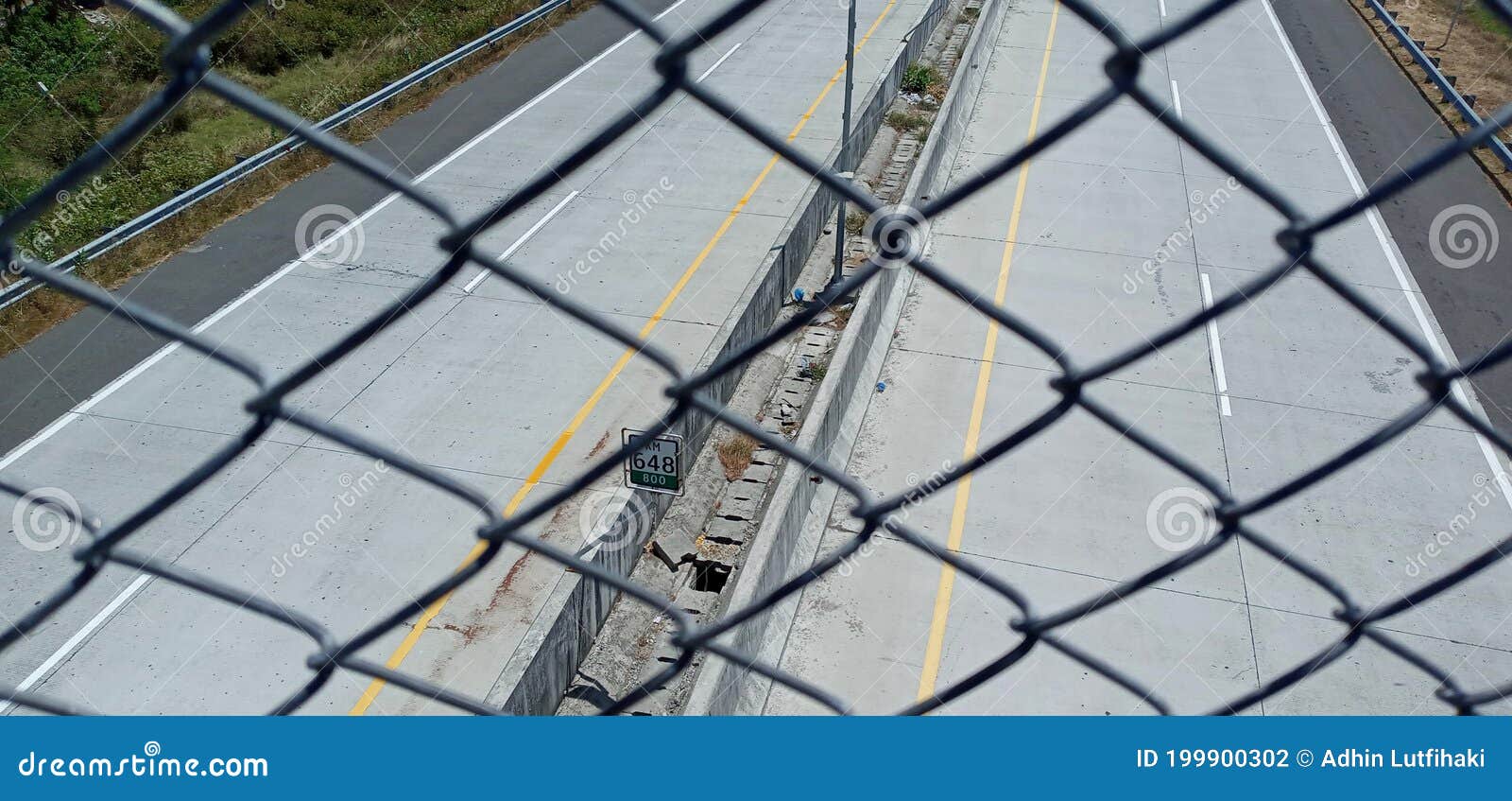 The Road under bridge stock photo. Image of fence, bridge - 199900302