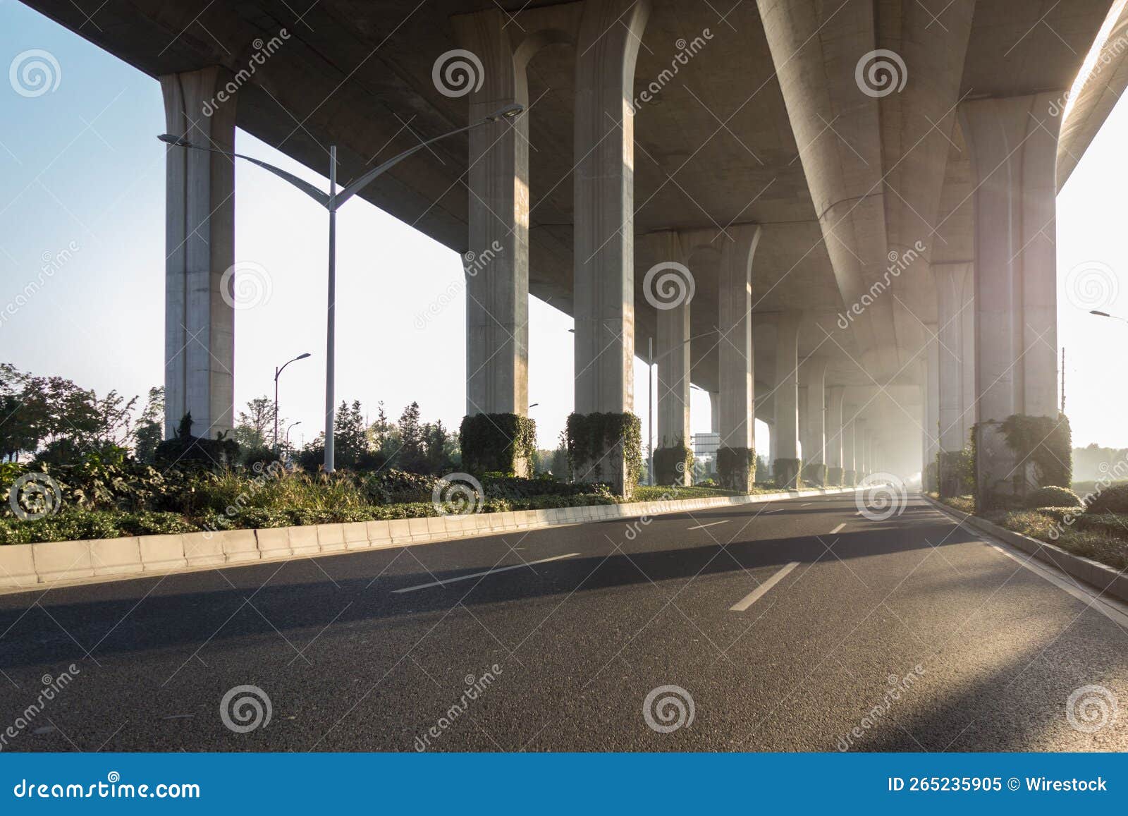 Road Under a Highway in Sunlight Stock Image - Image of city, clear ...