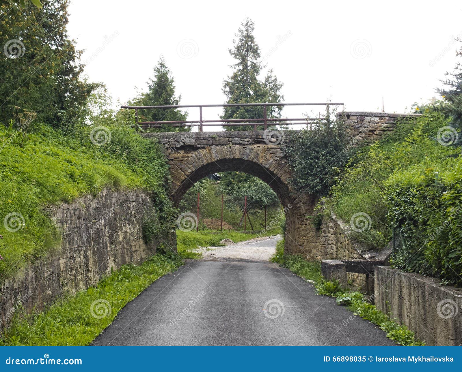 Road under an old bridge stock image. Image of tree, grey - 66898035