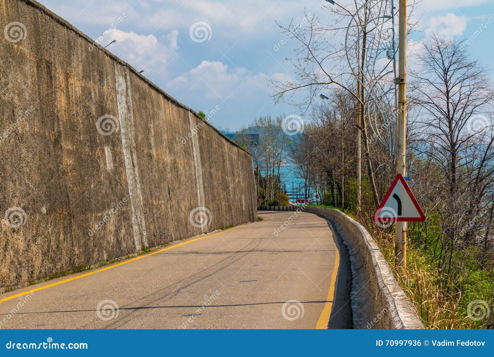 Road with wall on roadside stock photo. Image of architecture - 70997936