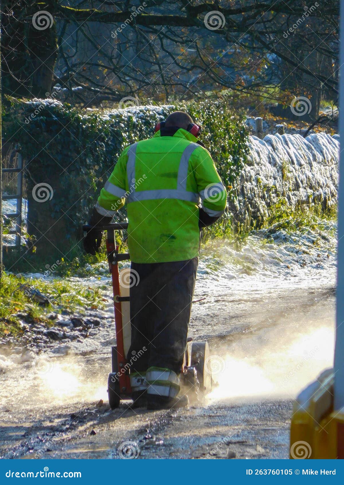Road Worker Cleaning City Street With High Pressure Power Washer ...